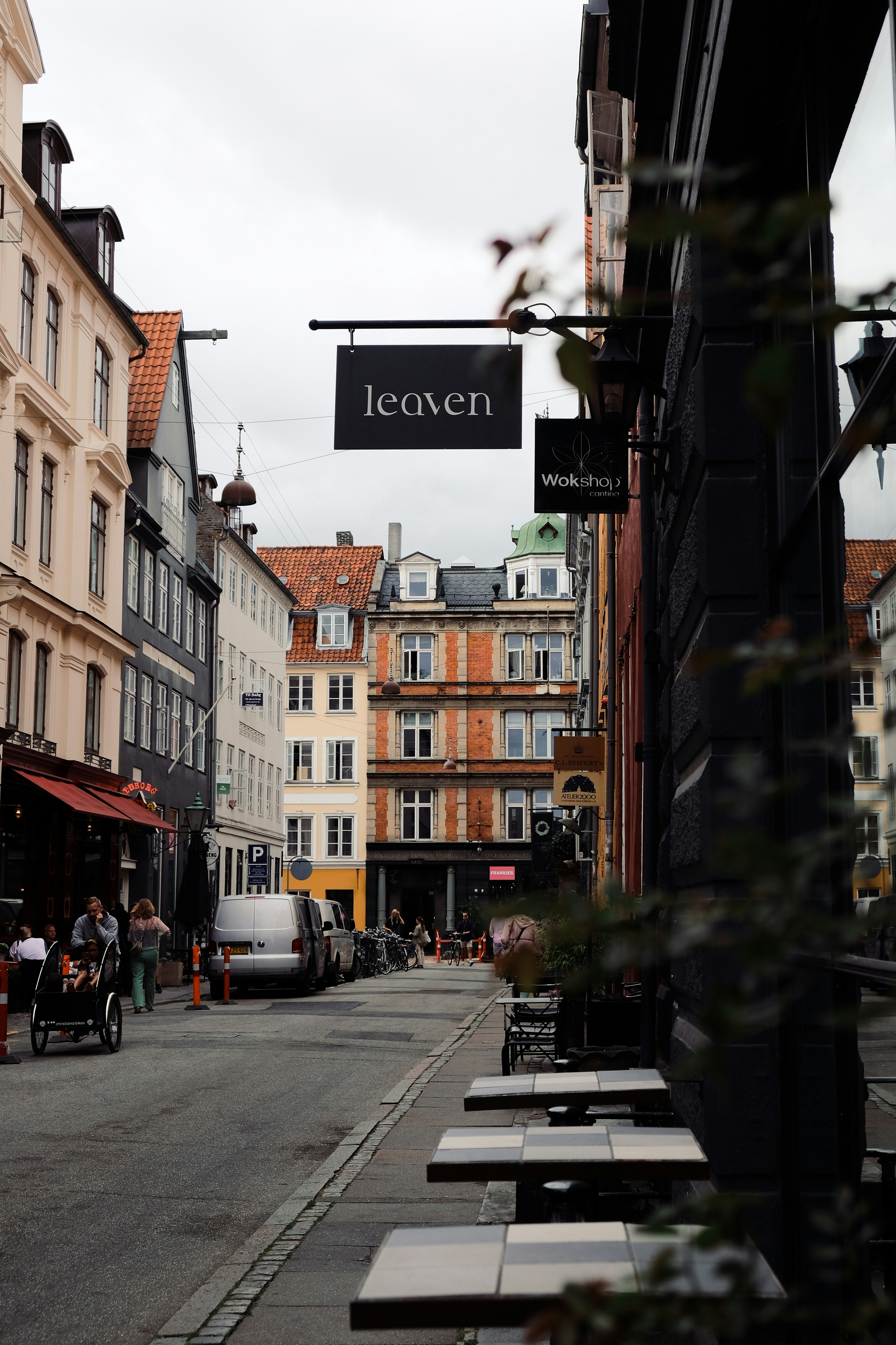 Leaven Sign Over a Narrow European Street