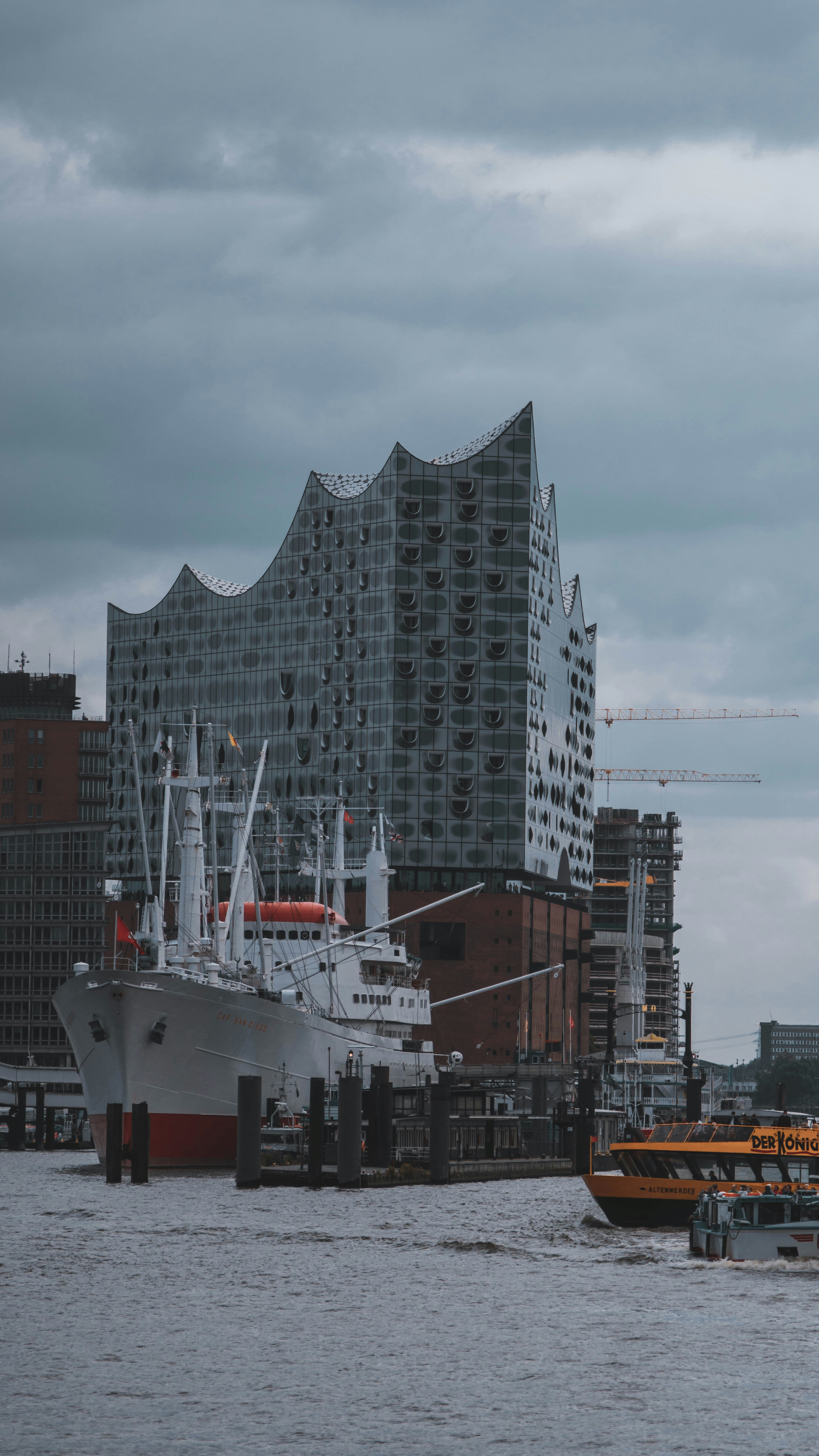 Glass Peaks Over Hamburg Harbor: Elbphilharmonie Framed by a Working Fleet