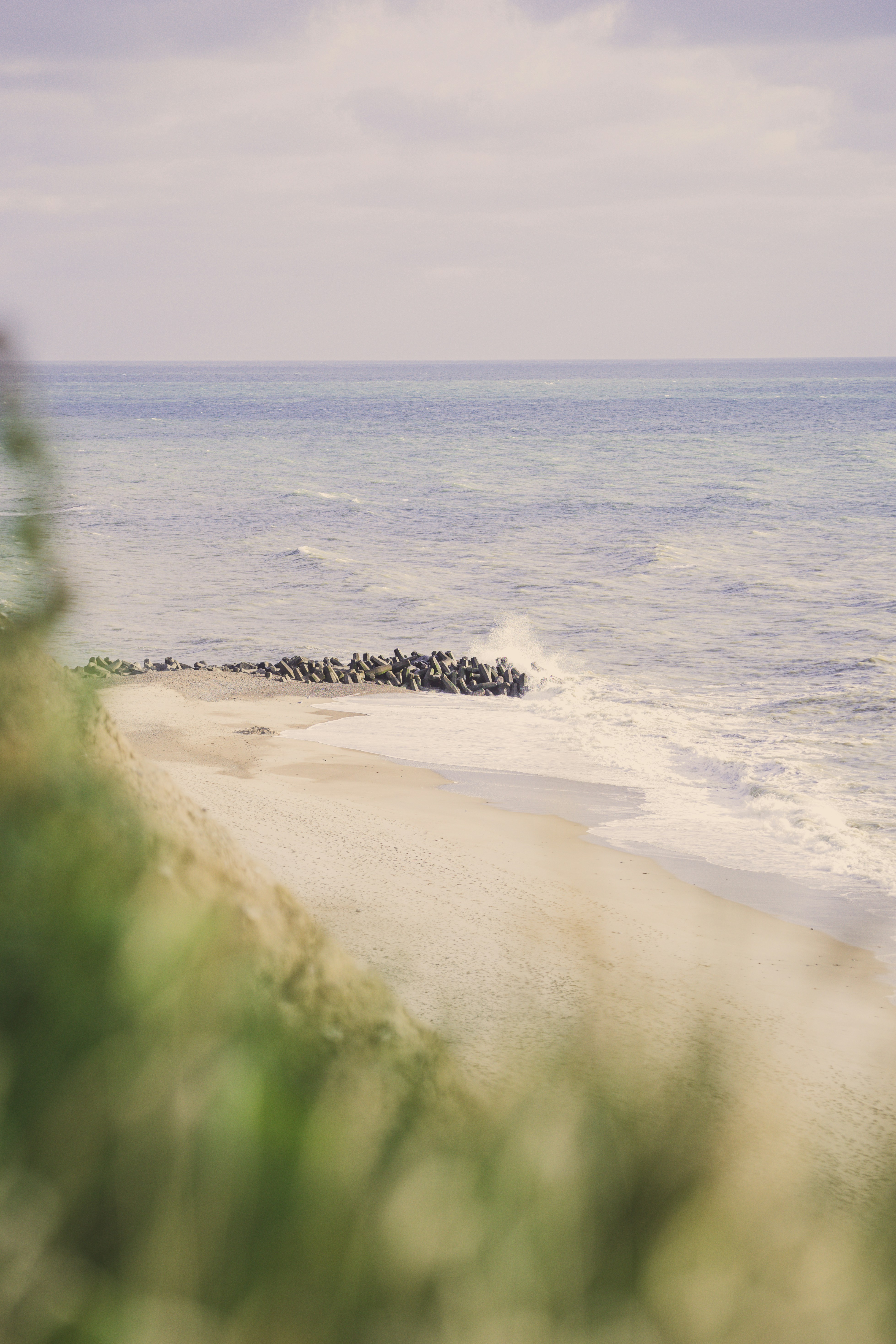 Pastel Breakwater: Quiet Curve of Waves