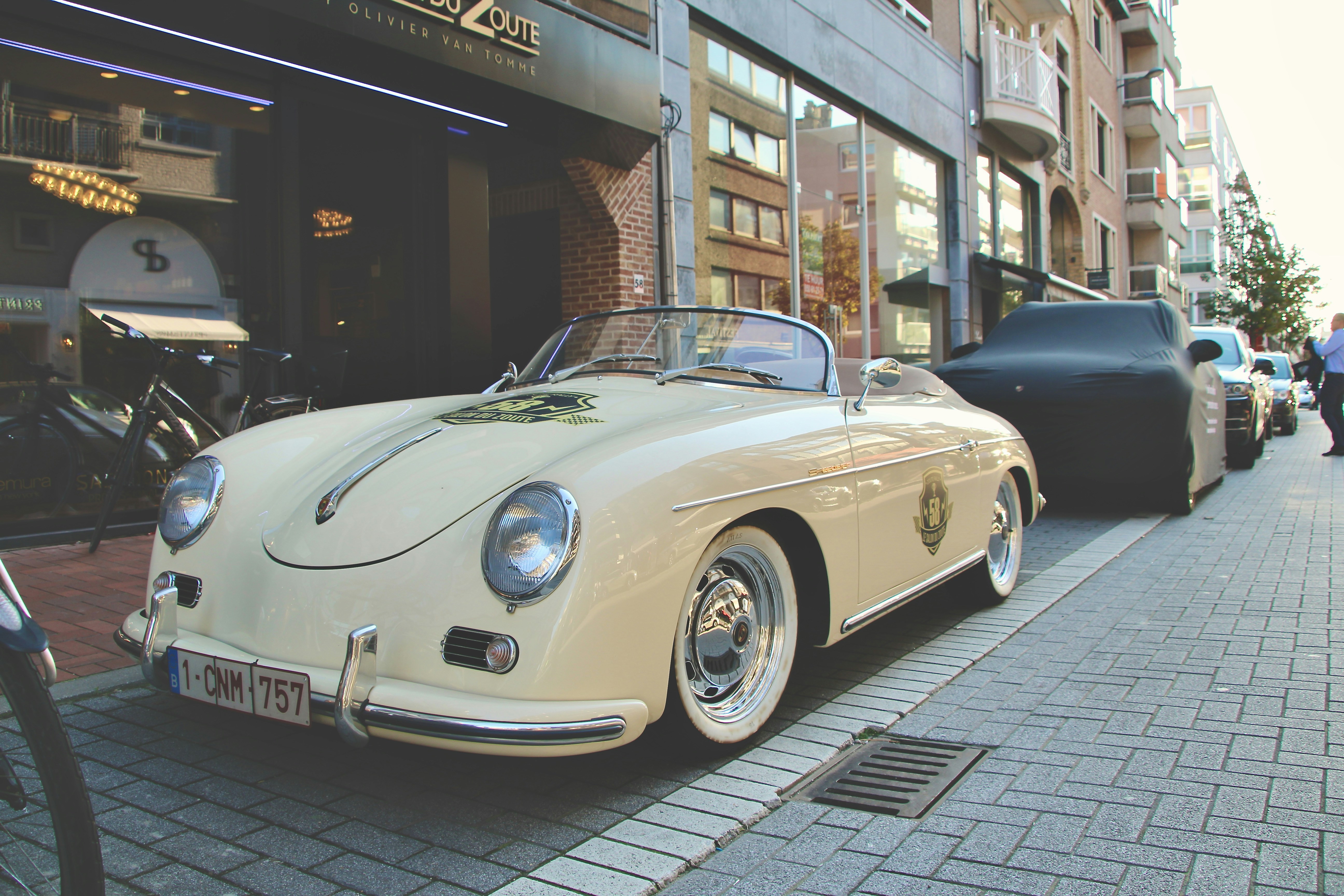 Cream Classic: A Vintage Porsche Sits Pristinely on the City Street