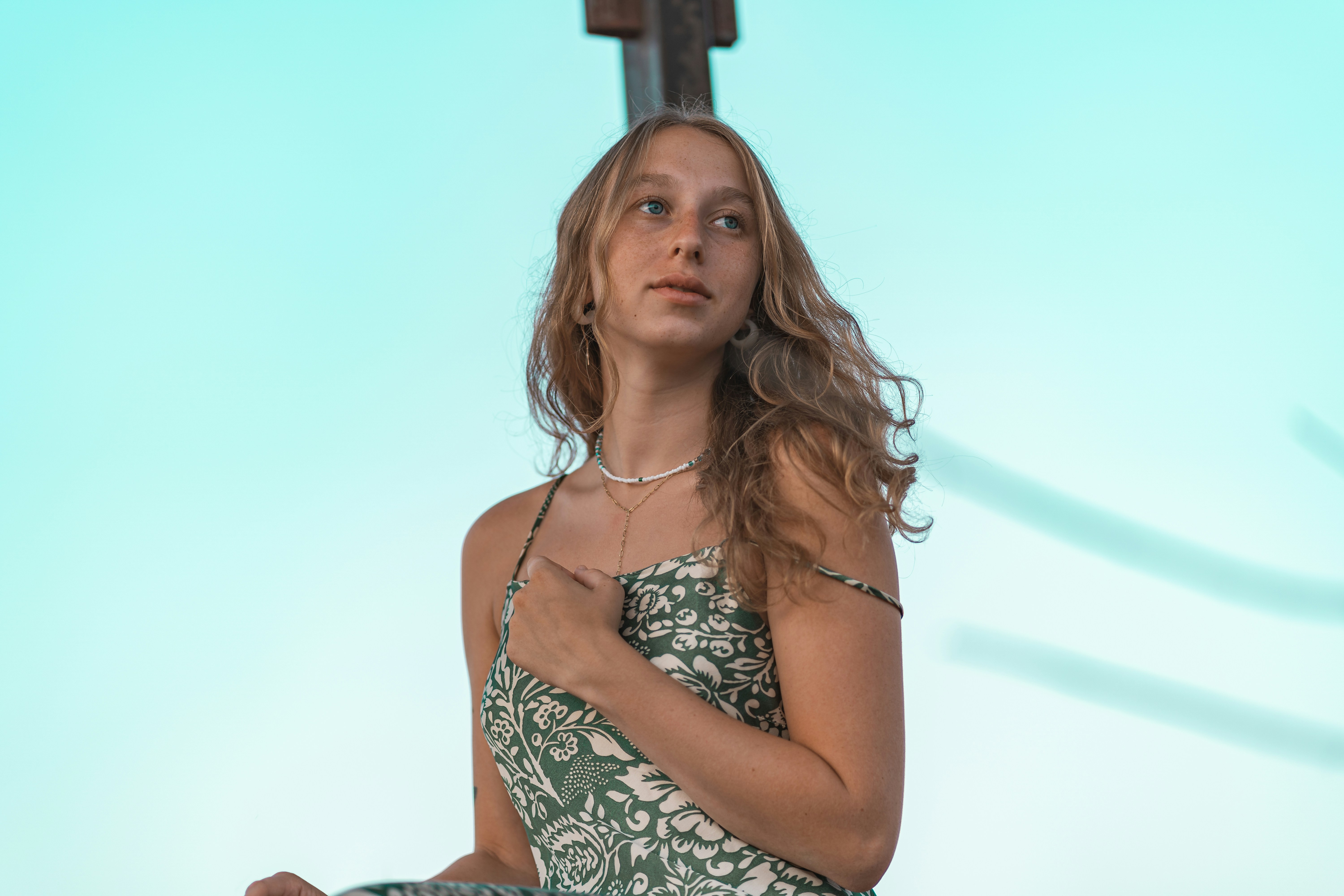 Emerald Florals Under Seafoam Light: A Quiet Portrait