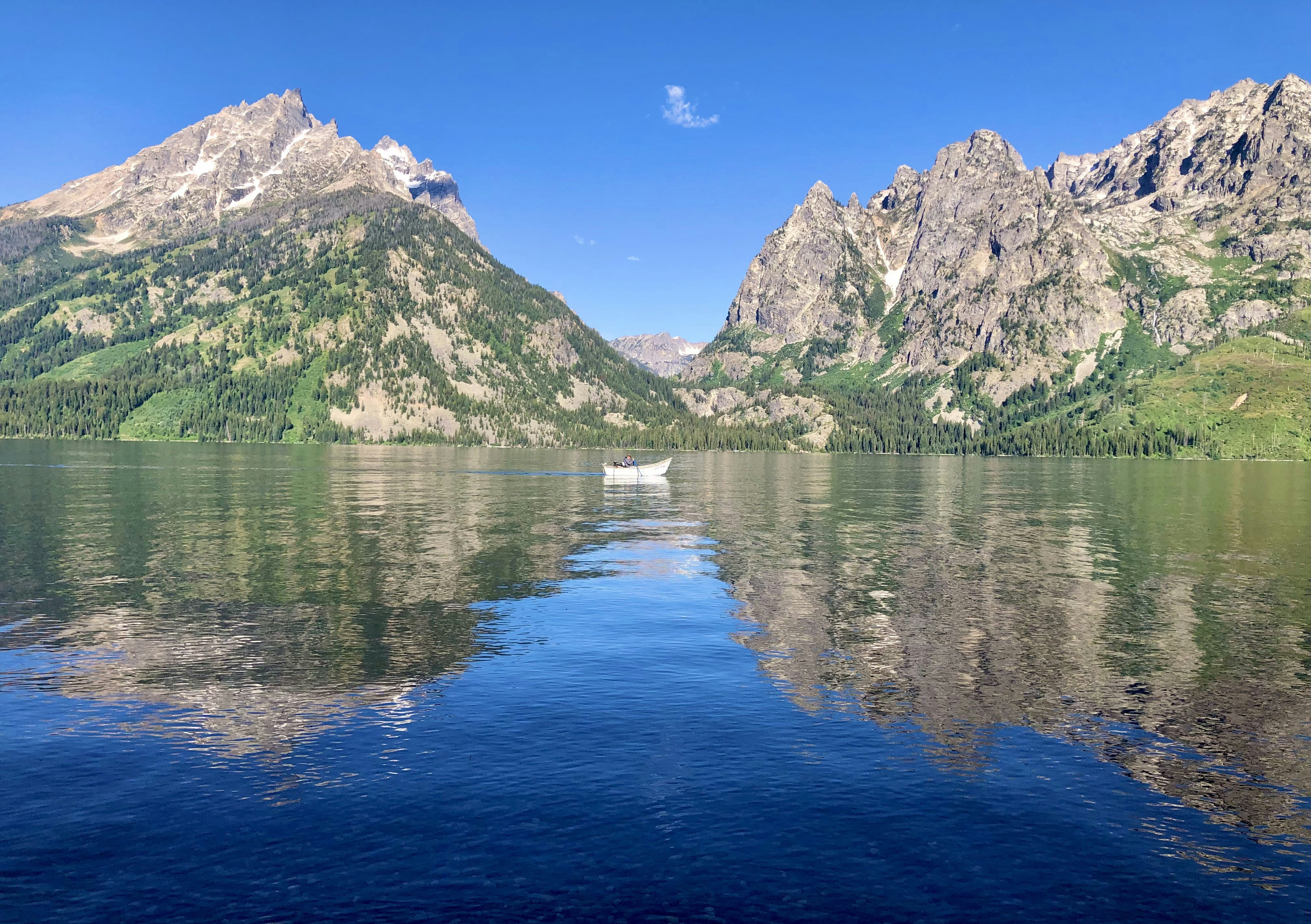 Alpine Mirror: Snow-Kissed Peaks Reflected in a Glassy Lake