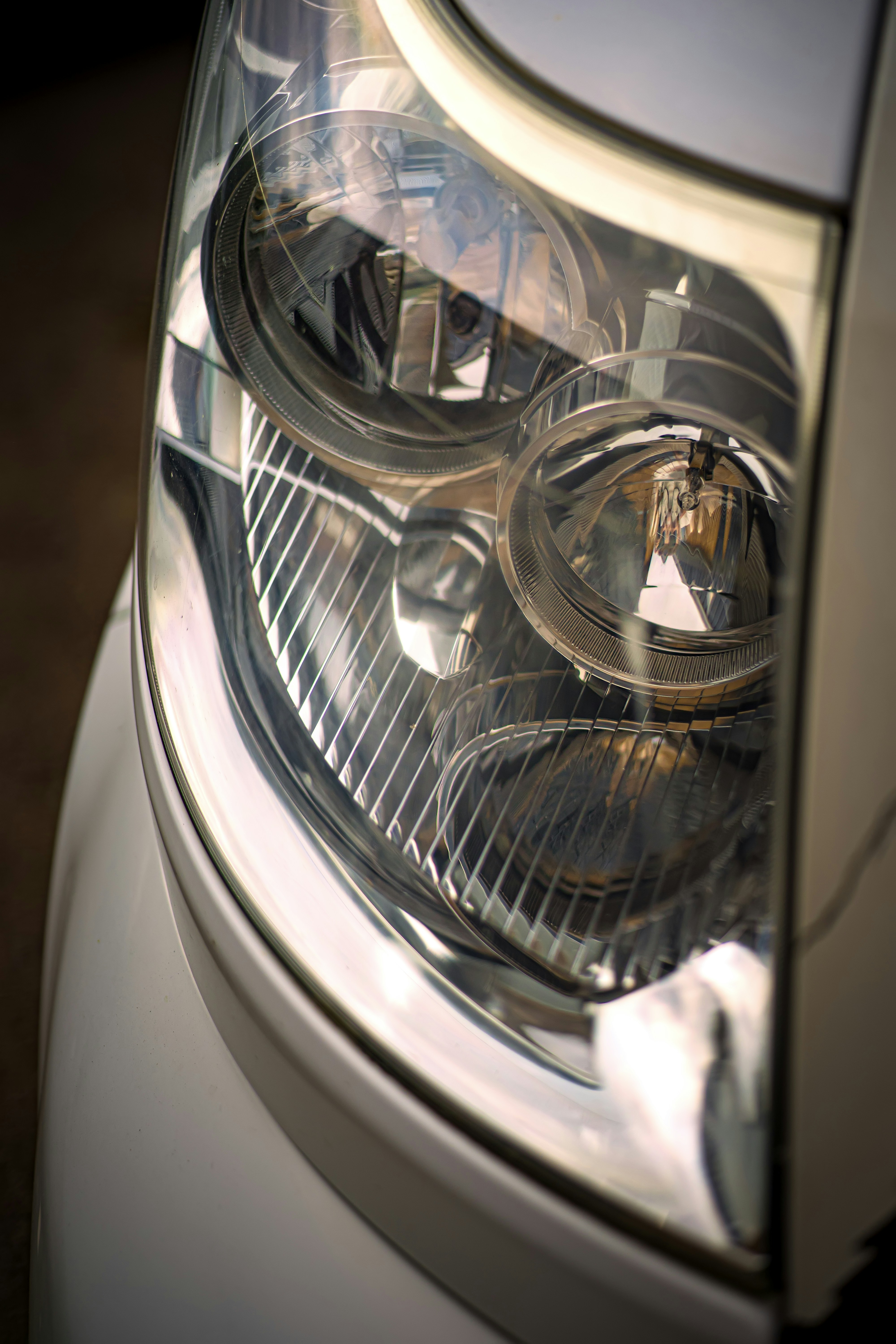 Concentric Glass: A Macro Portrait of a Car Headlight's Inner Lenses
