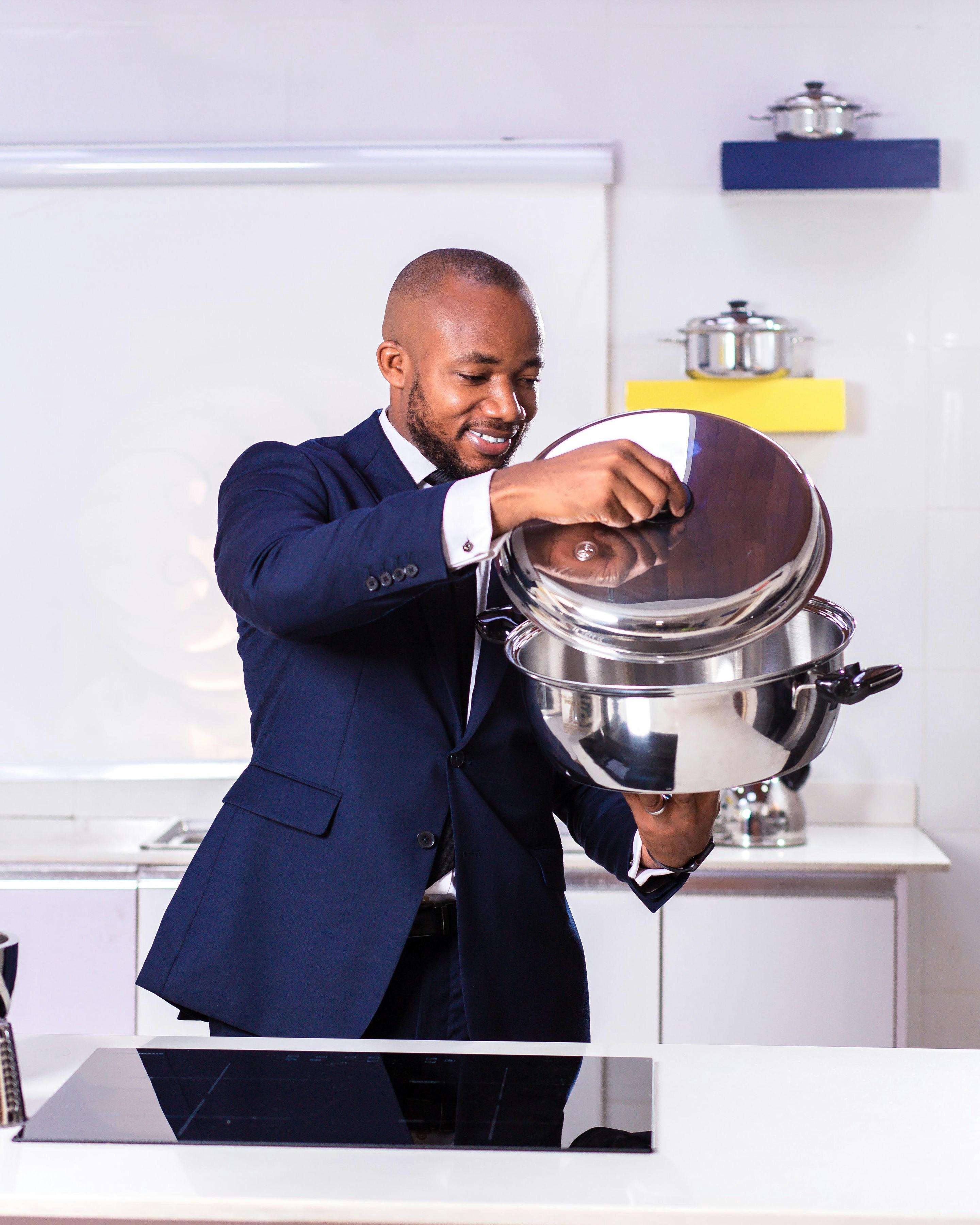 Man in black suit holding stainless steel cooking pot photo – Free ...