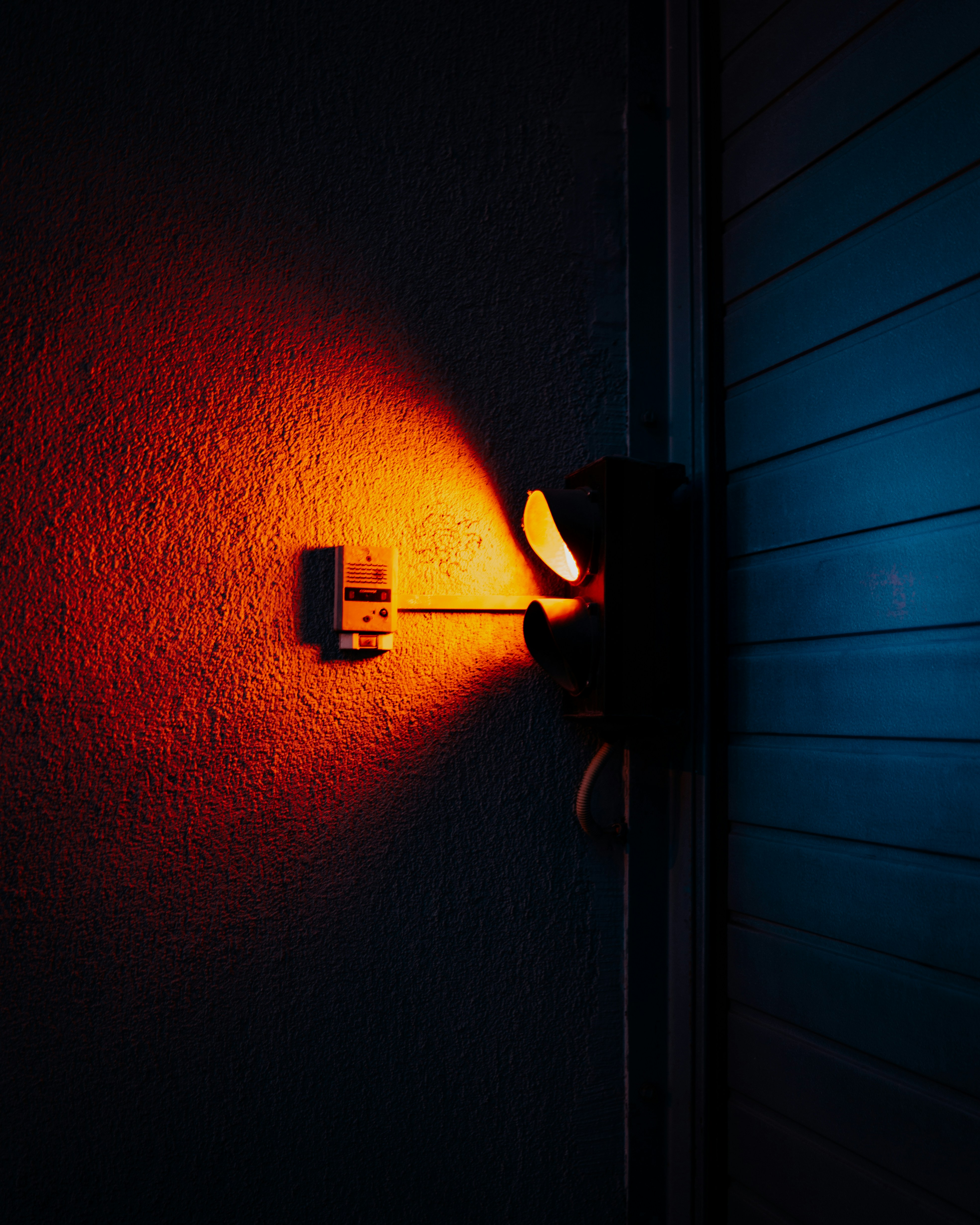 Ember Halo Across a Dual-Tone Wall