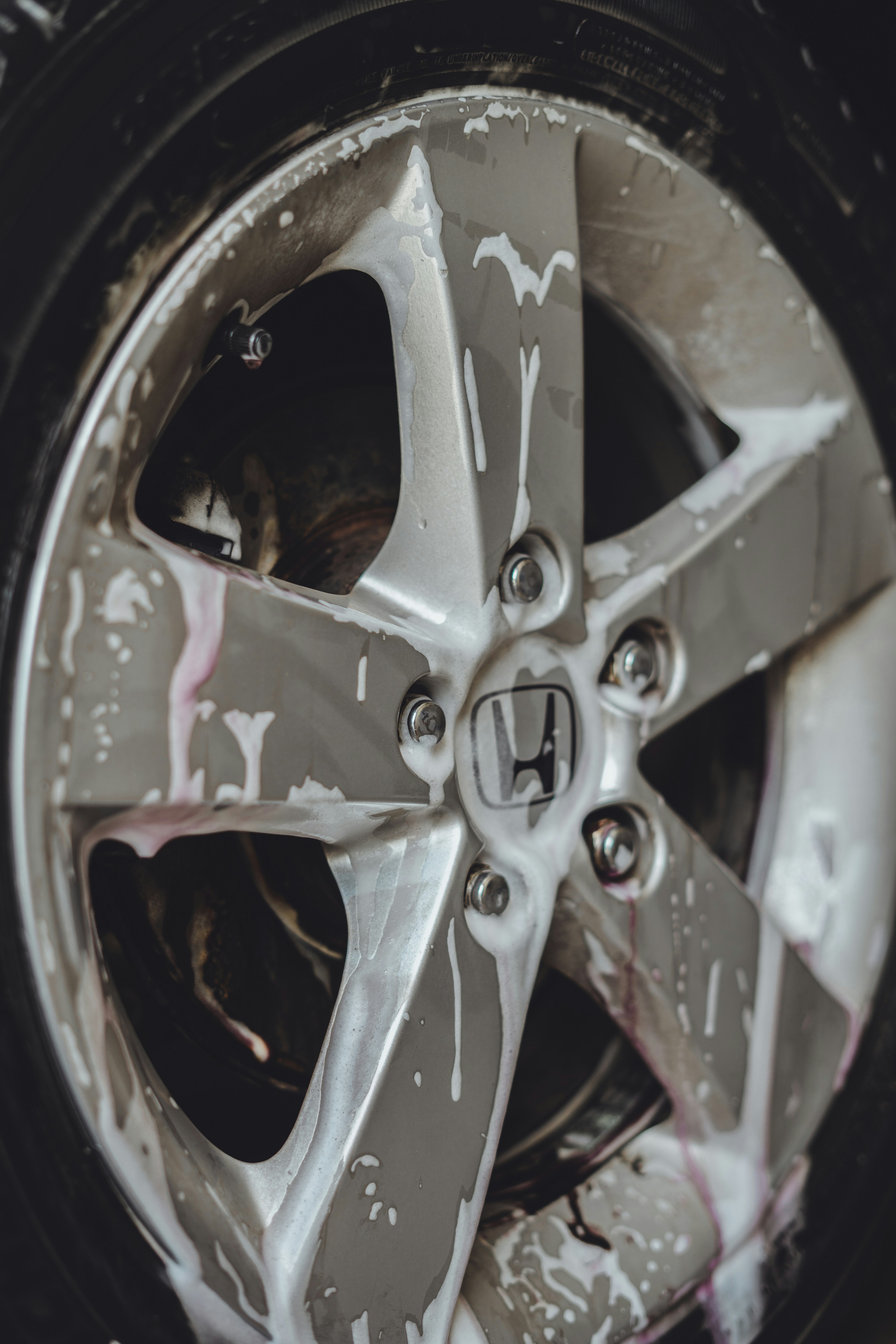 Dripping paint on a Honda alloy wheel close-up