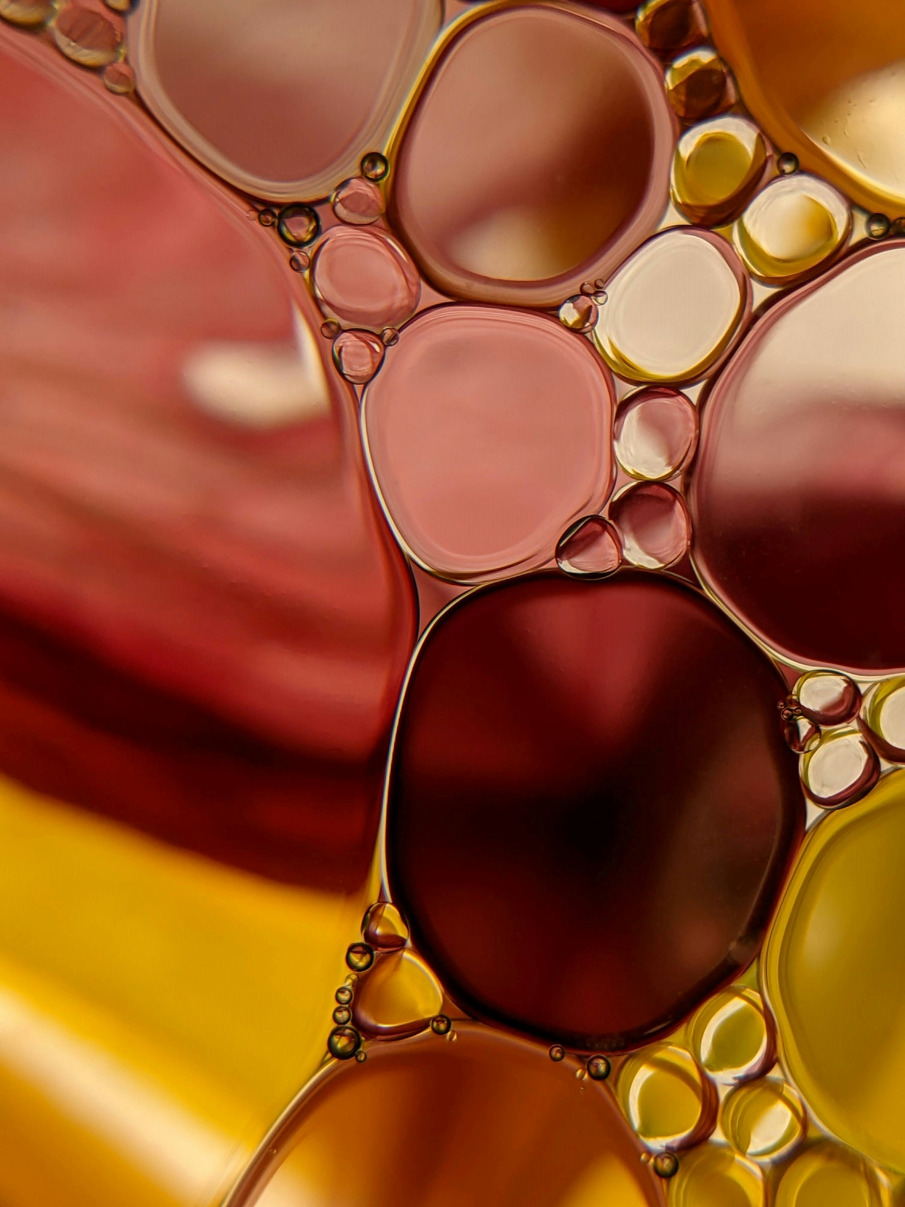 Warm Orb Mosaic: Close-Up of Oil Bubbles in a Velvet Hue Palette
