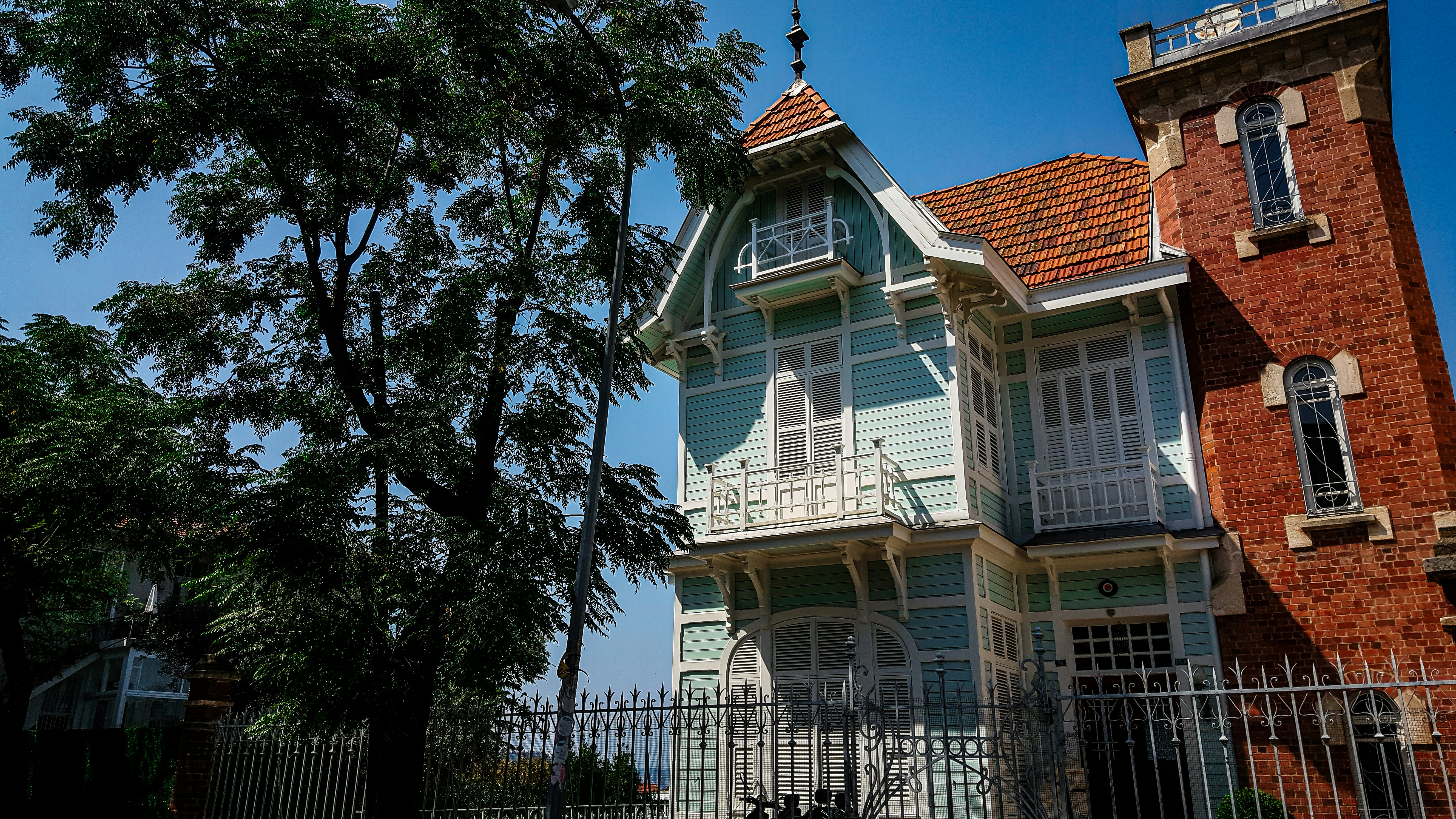 Pastel Victorian Gables Bathed in Summer Light