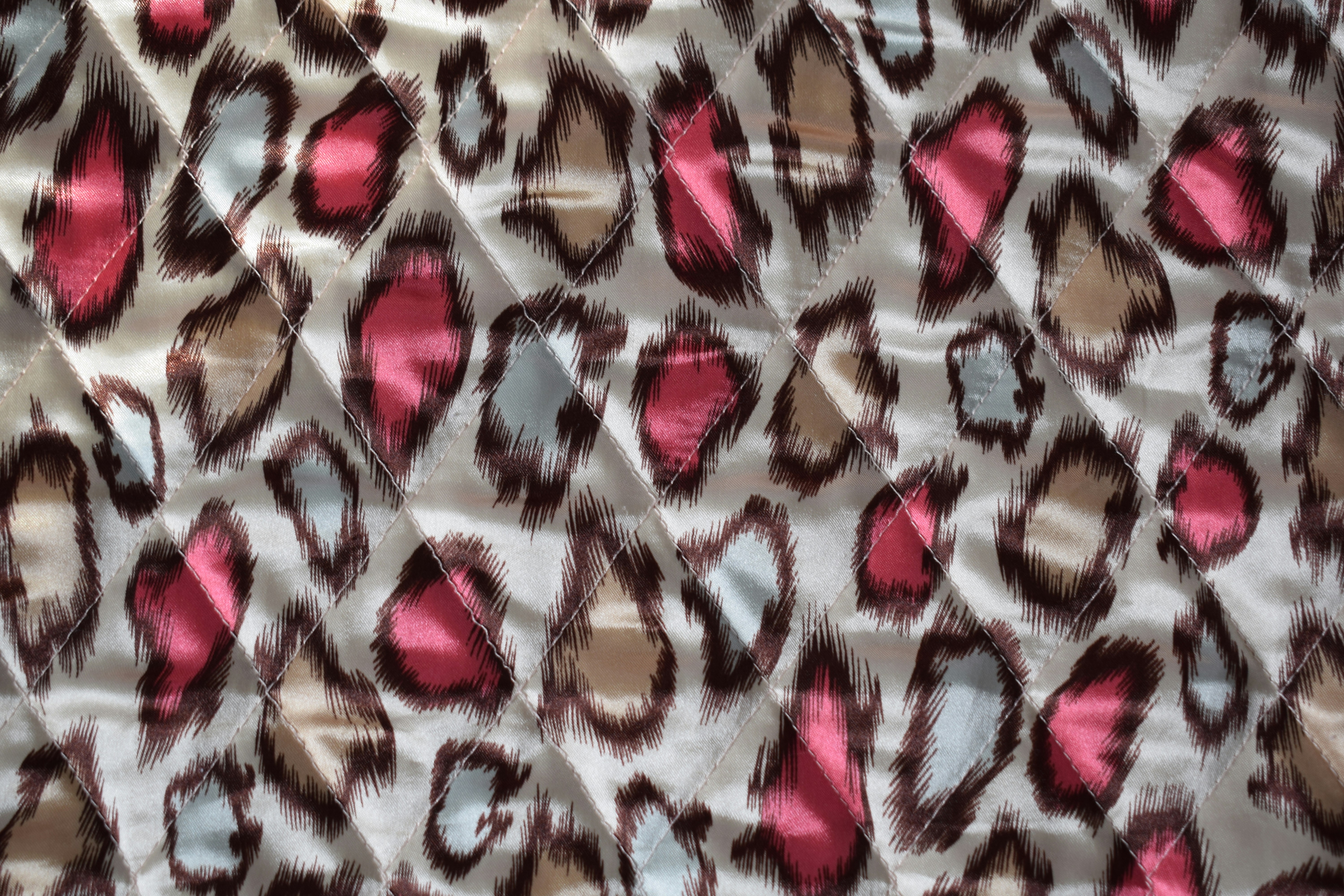 Rosy Leopard Mosaic: Pink Rosette Pattern on Soft Fabric