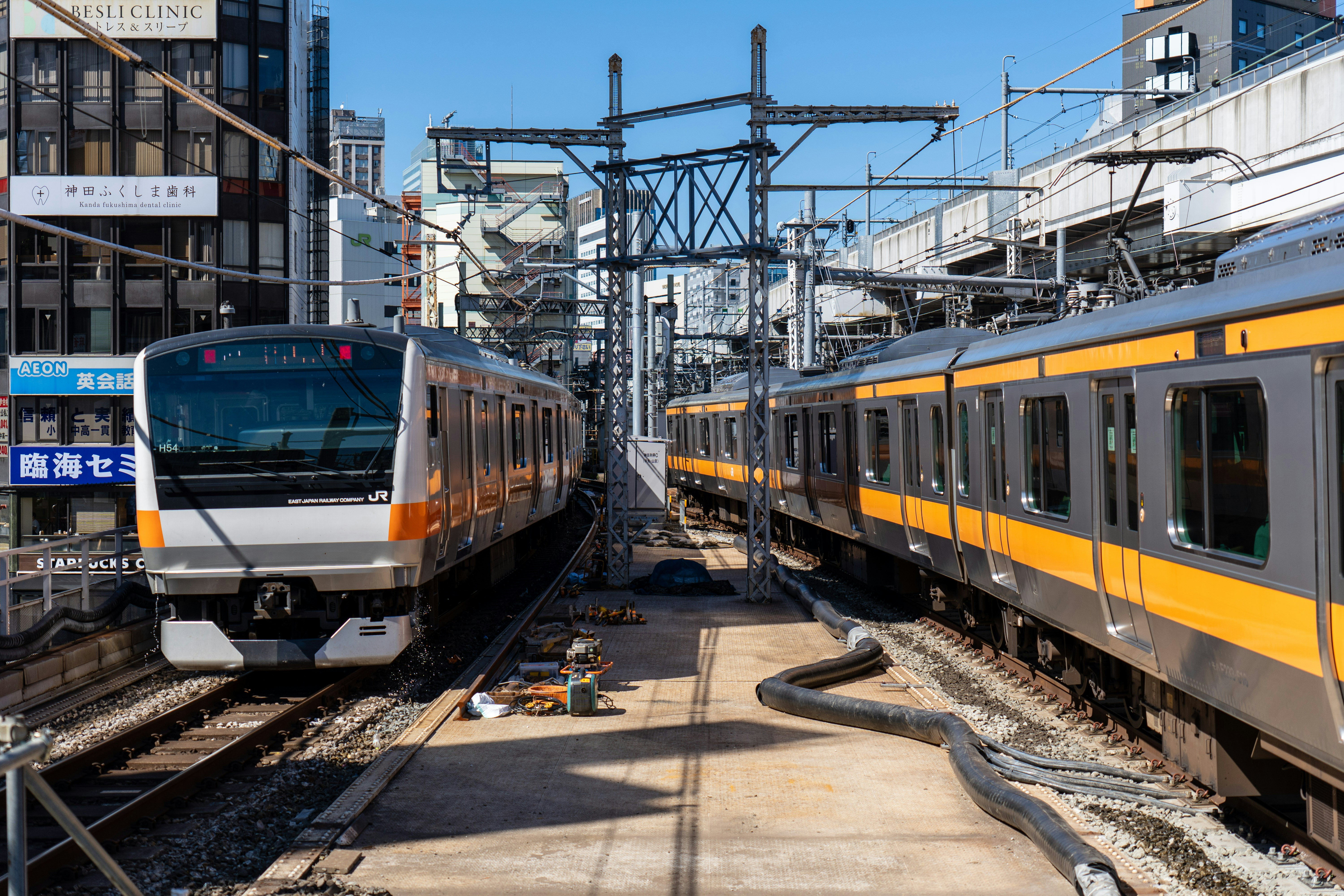 Yellow and green train on rail tracks during daytime photo – Free ...