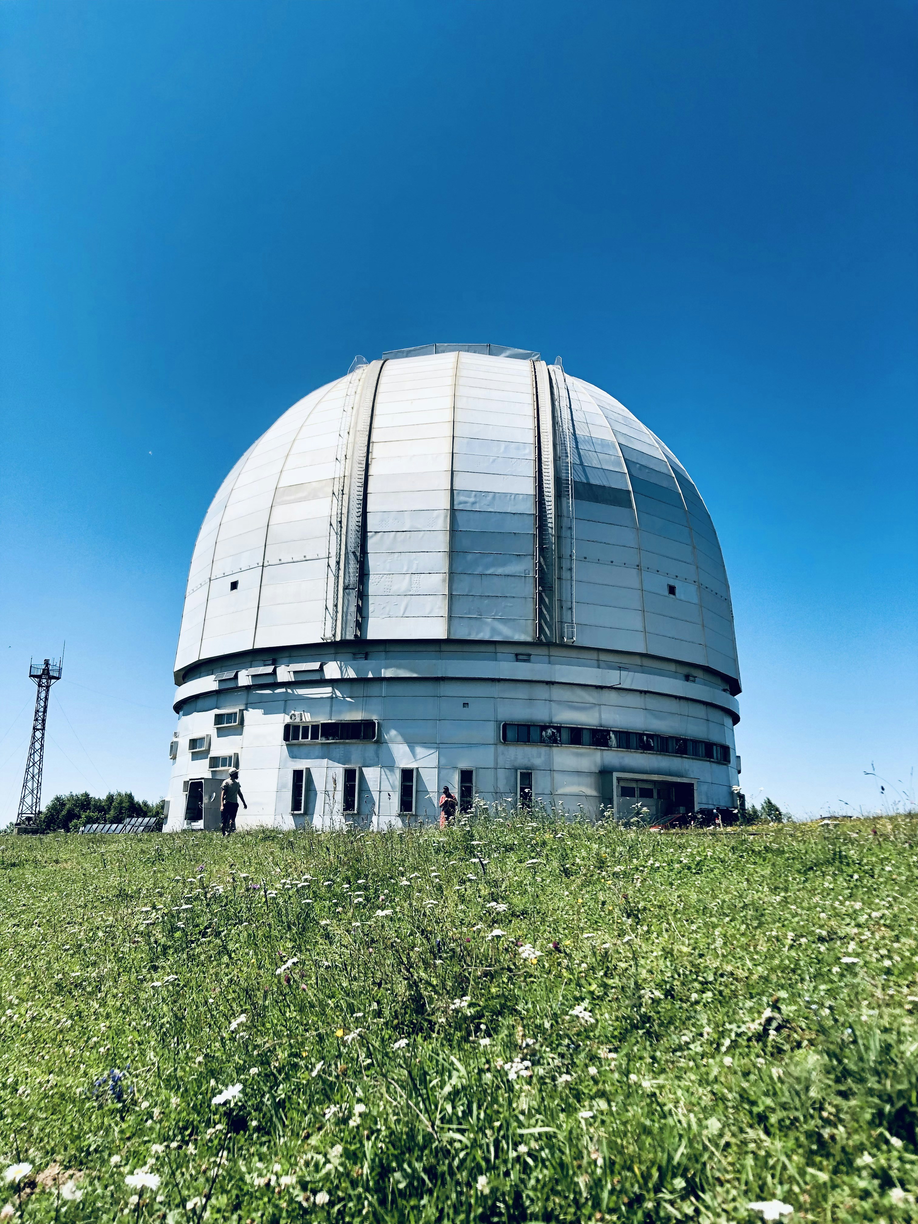 Space Observatory in the Arkhyz mountains. Photographer: Denis Zelenykh aka Lorrrem | white dome building on green grass field during daytime
