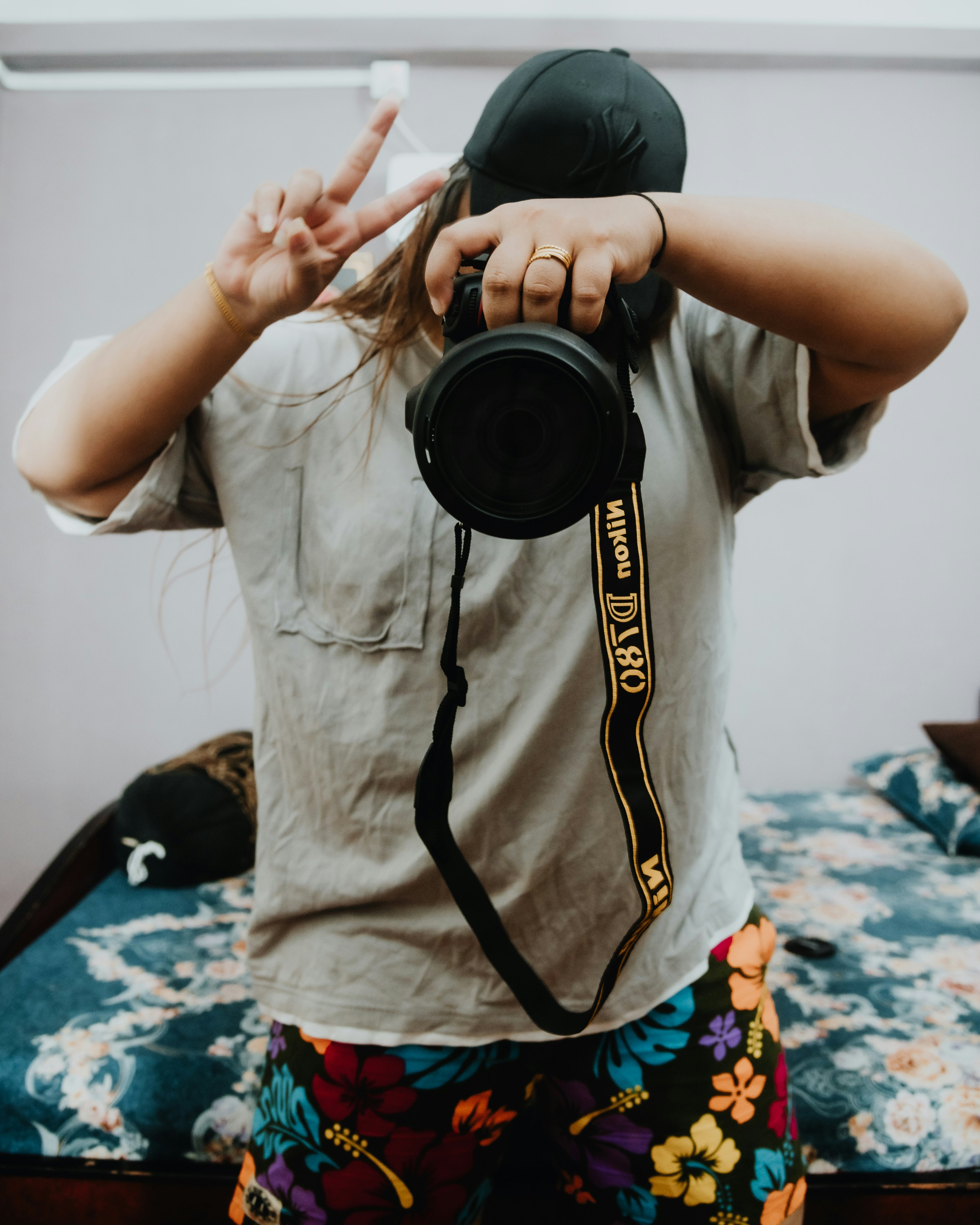 Centered View: Mirror Self-Portrait with a Pro Lens and Tropical Flair
