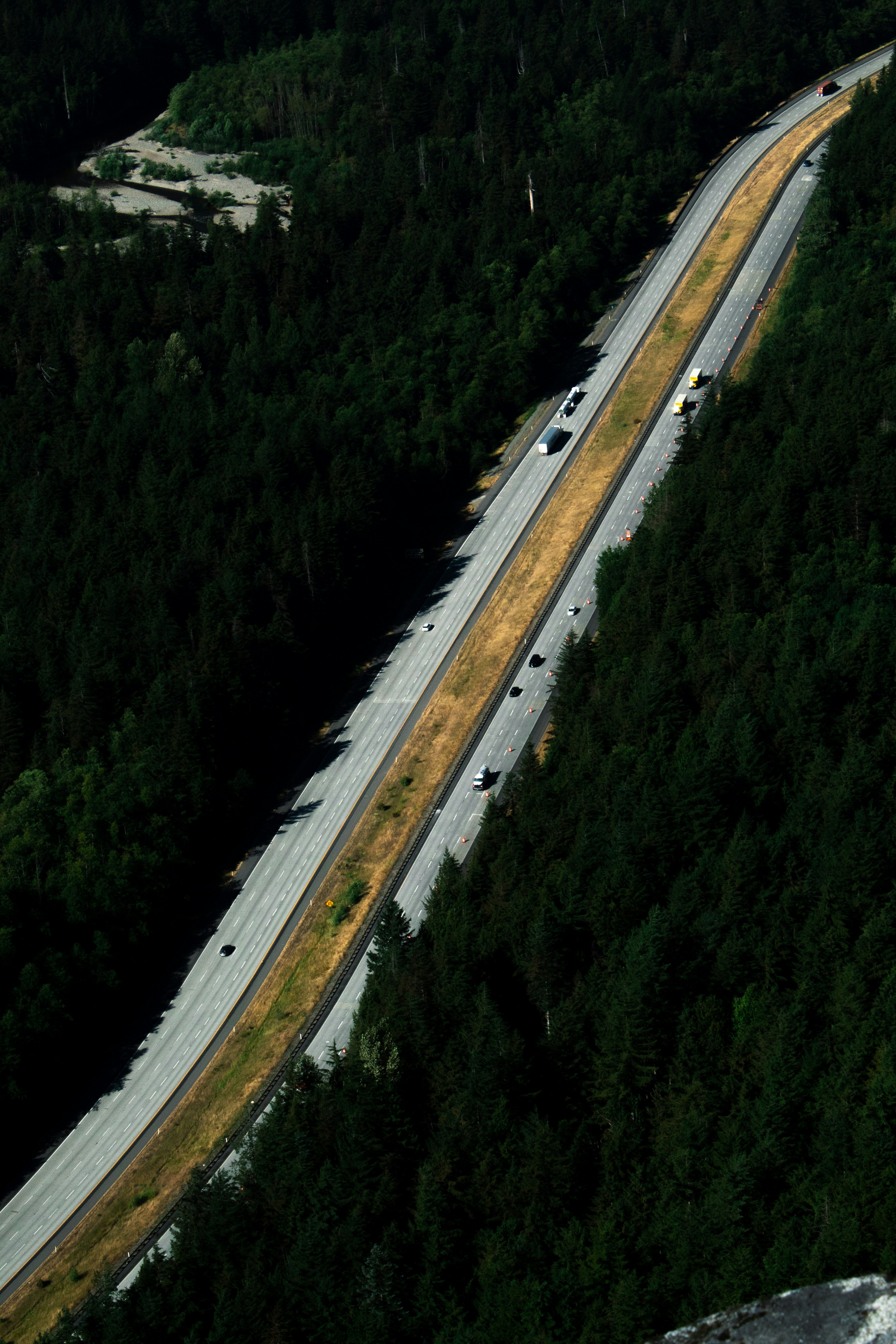 The freeway wiggles through the forest.