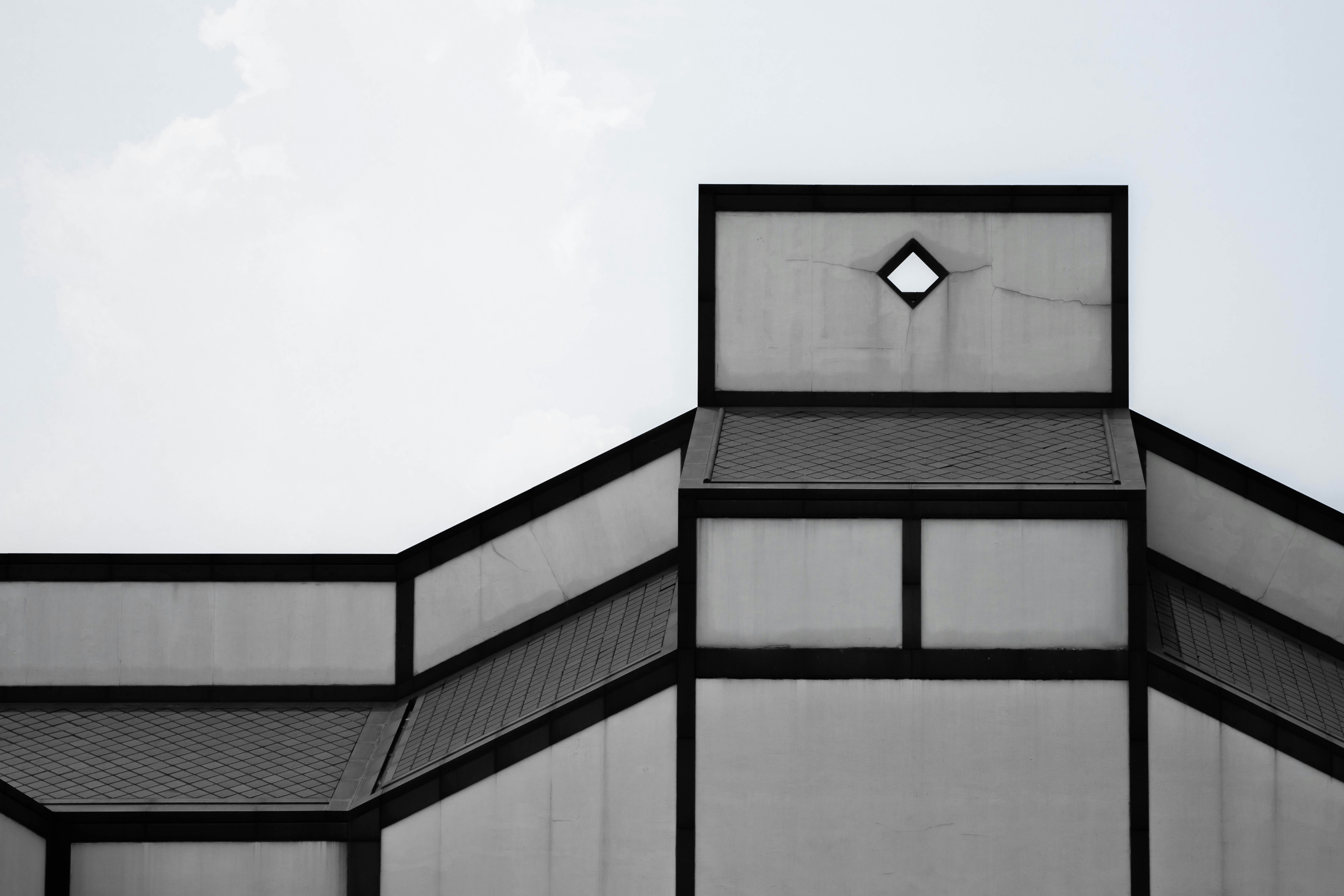 Monolithic Rooftop Geometry with Framed Diamond Emblem