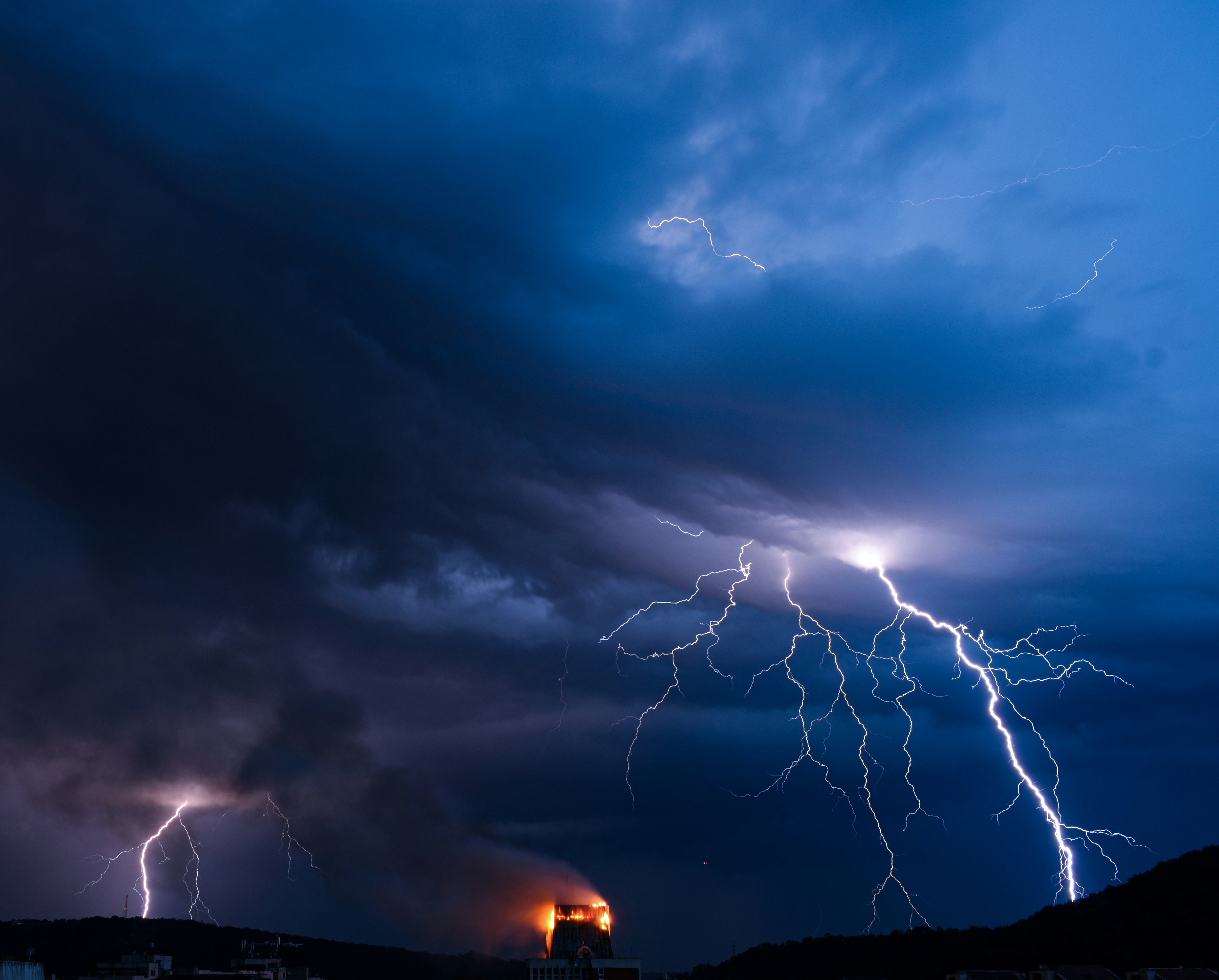 A lightning storm is seen over a city at night photo – Free România ...