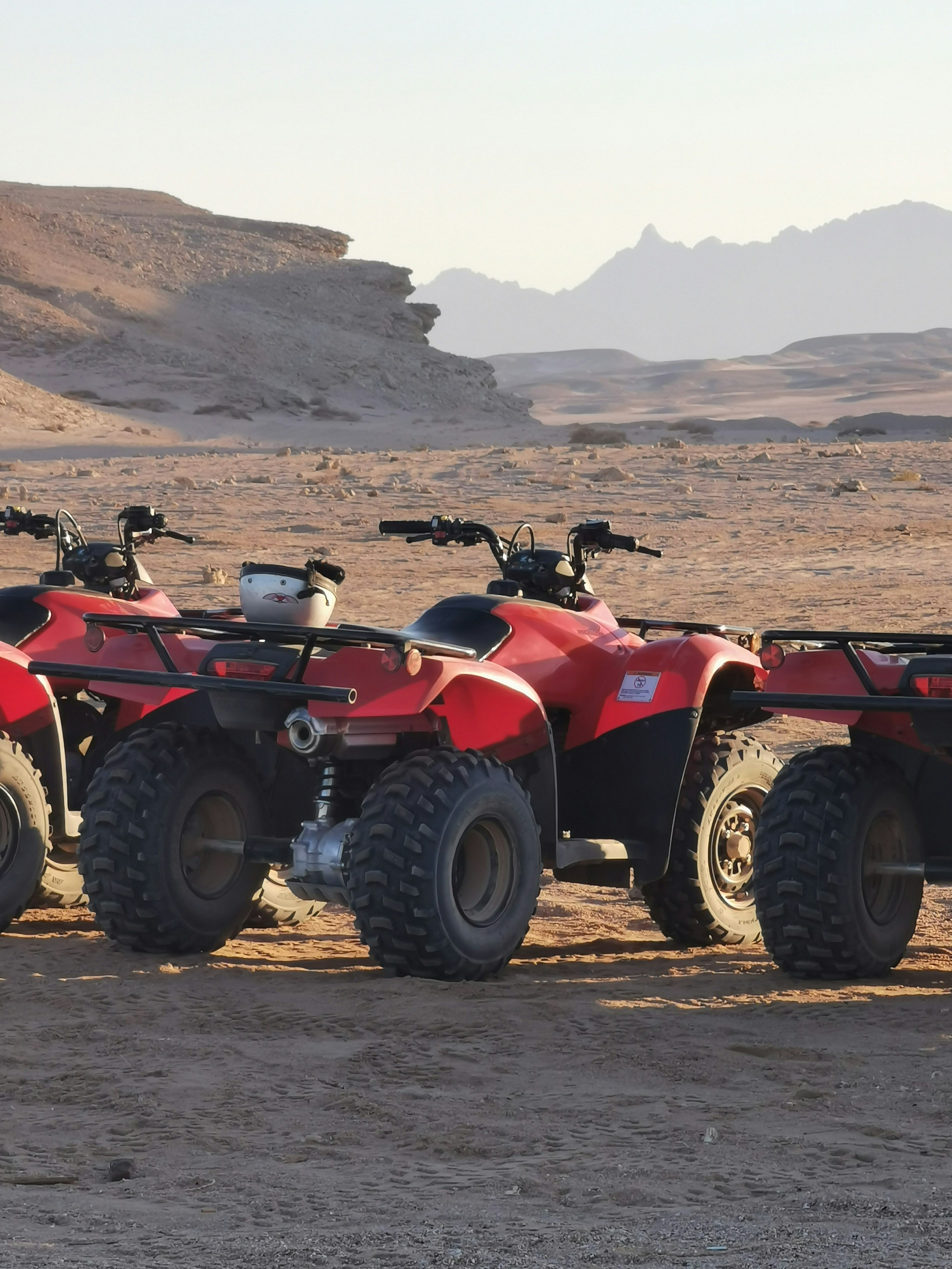 Red and black atv on brown sand photo – Free Desert sunset Image on ...