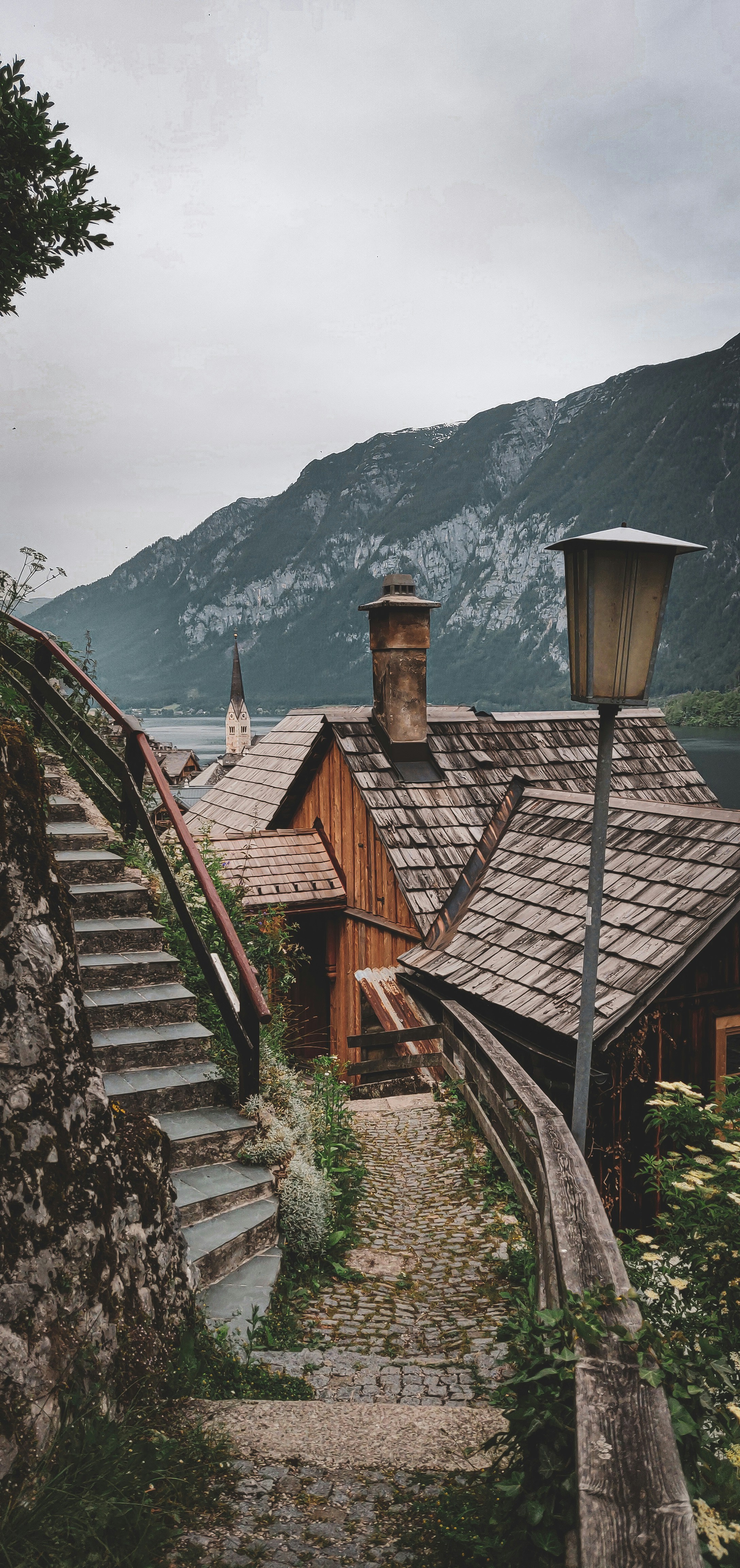 Staircase Serenade: Timbered Village Framed by Alpine Peaks