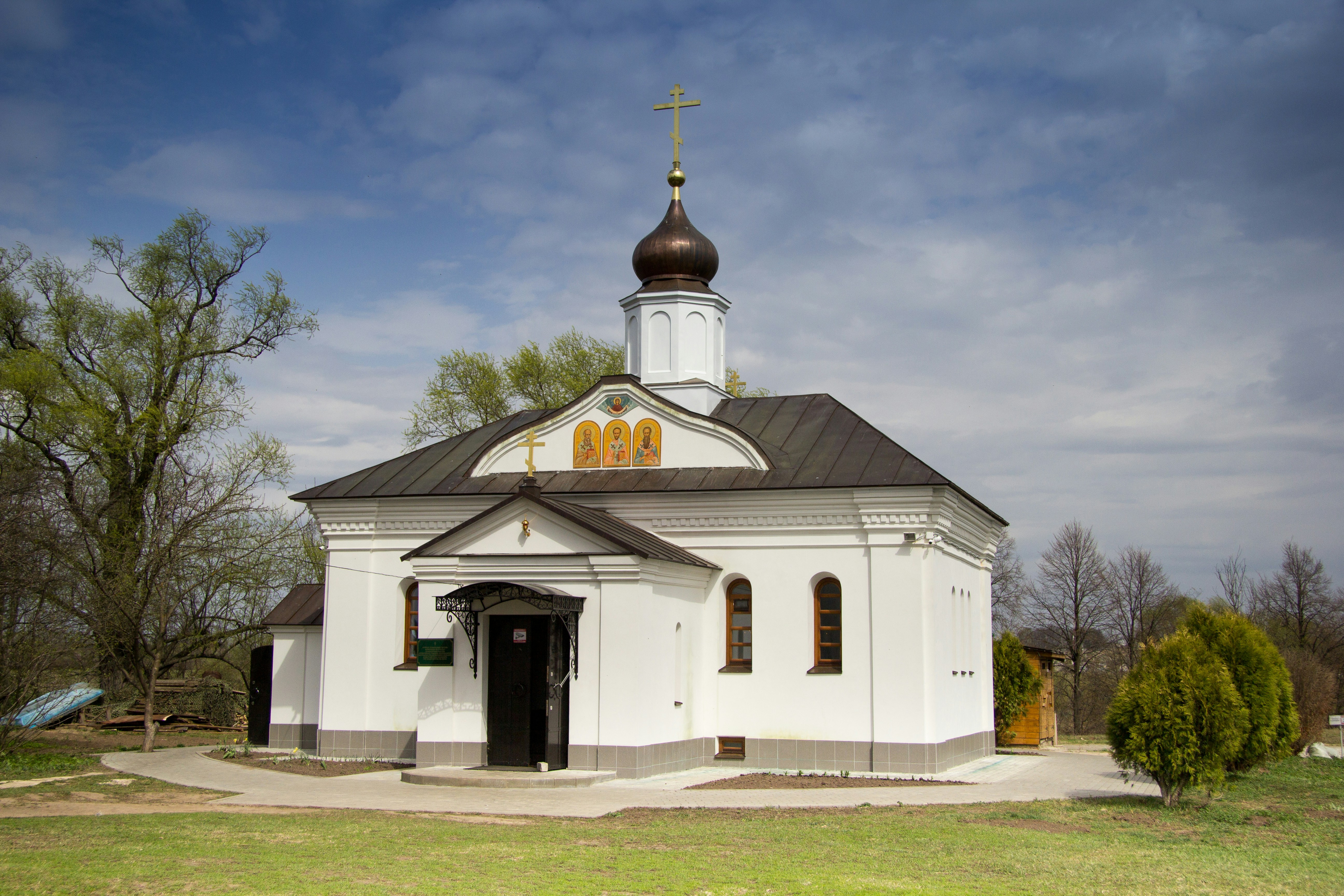 White and brown concrete church under blue sky during daytime photo ...