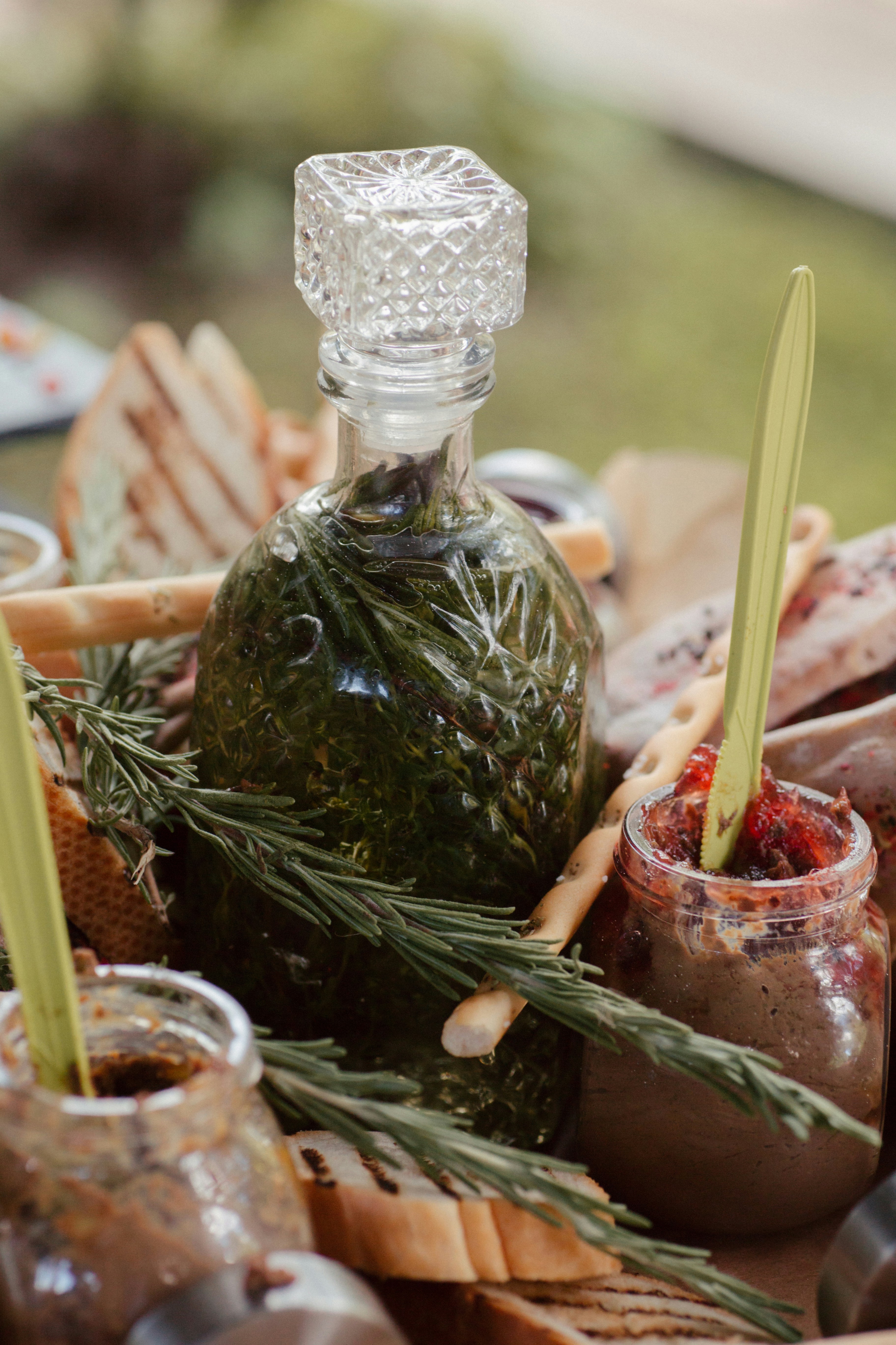 Verdant Glass: Olive Oil Infusion at the Center of a Rustic Charcuterie