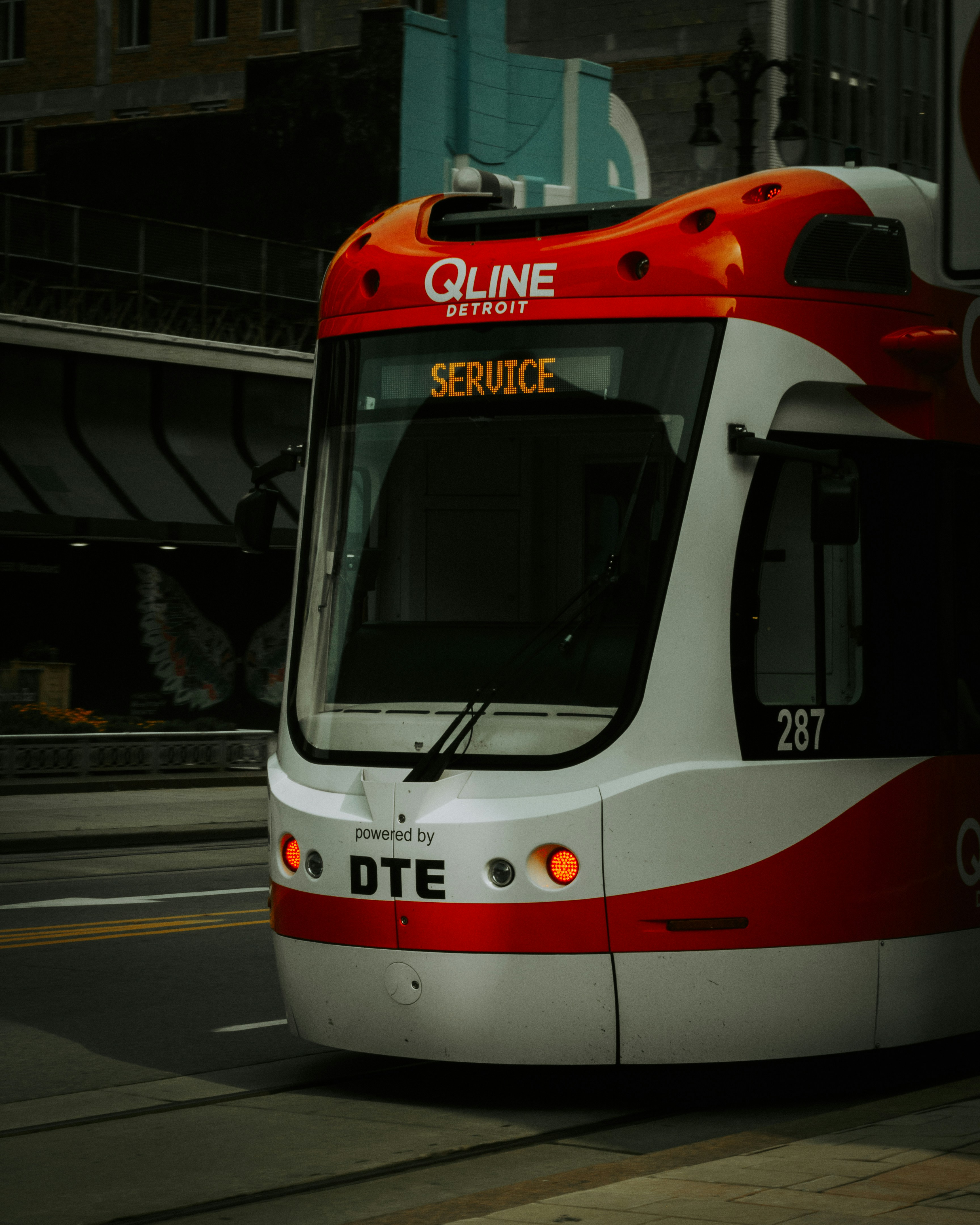 Detroit QLINE Front View: Red and White Transit Vehicle Ready to Glide