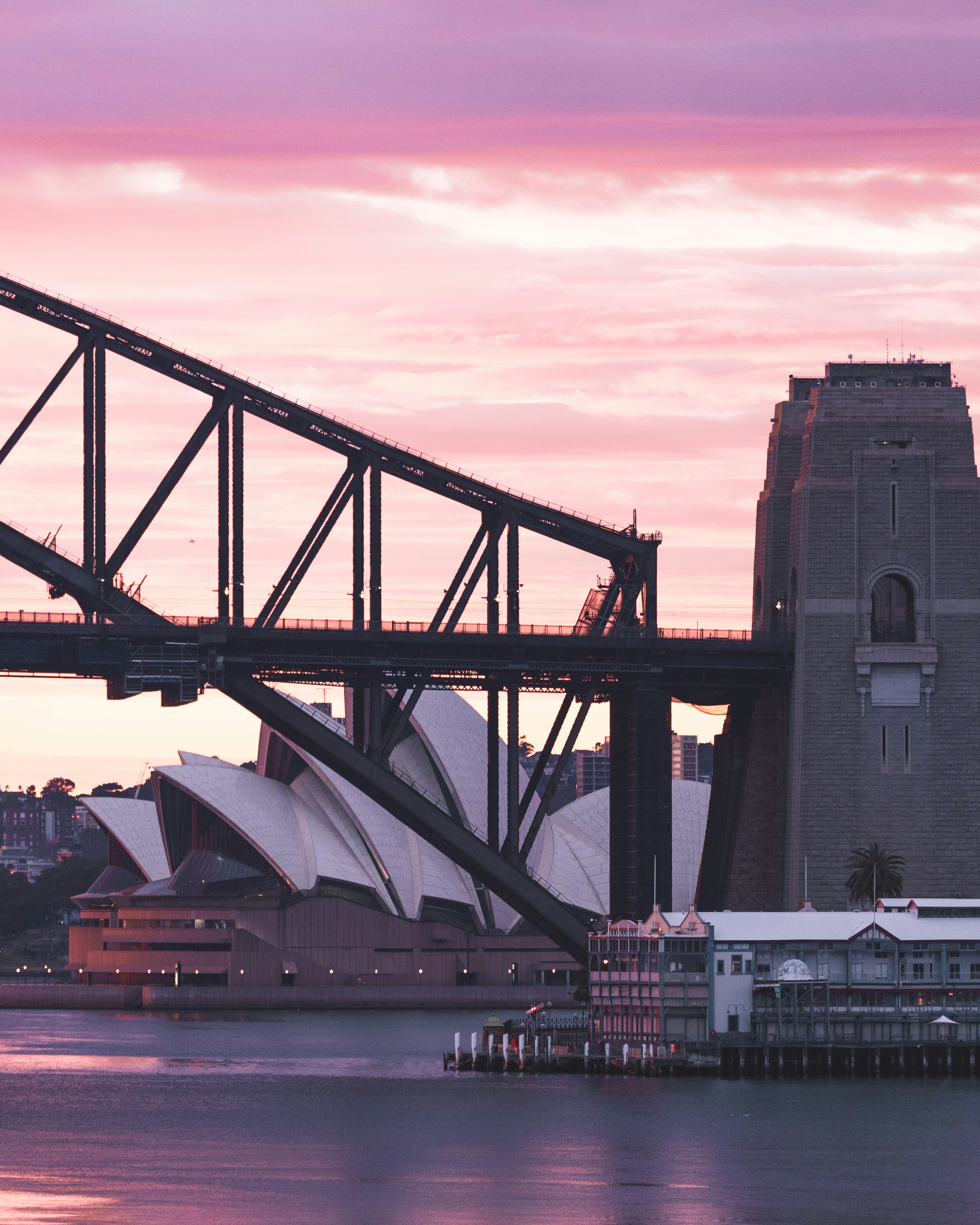 Sunset over Sydney: Bridge, Opera House, and harbor silhouette