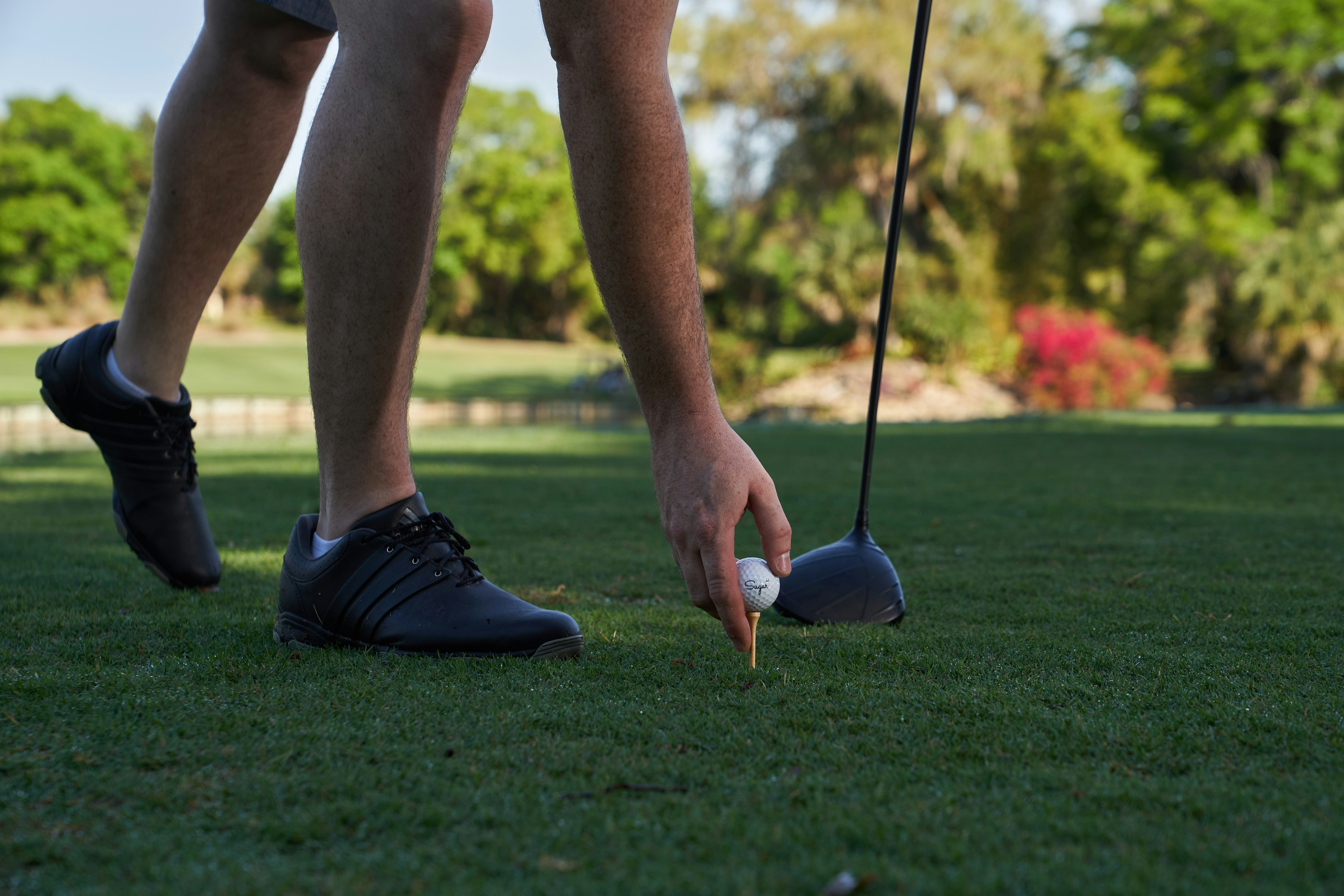 Person holding golf club during daytime photo – Free Golf Image on Unsplash