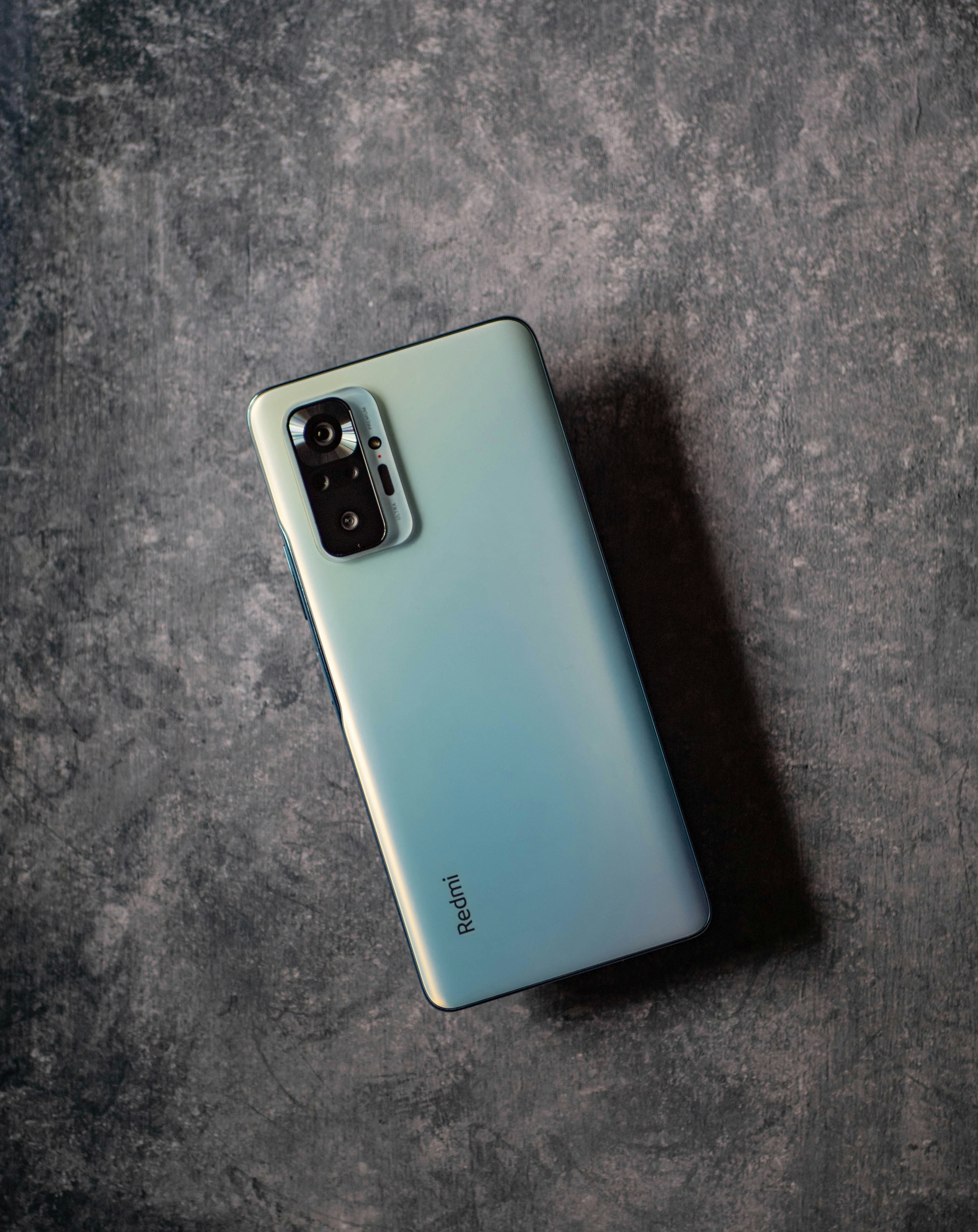 Blue samsung android smartphone on black textile photo – Free Cell ...