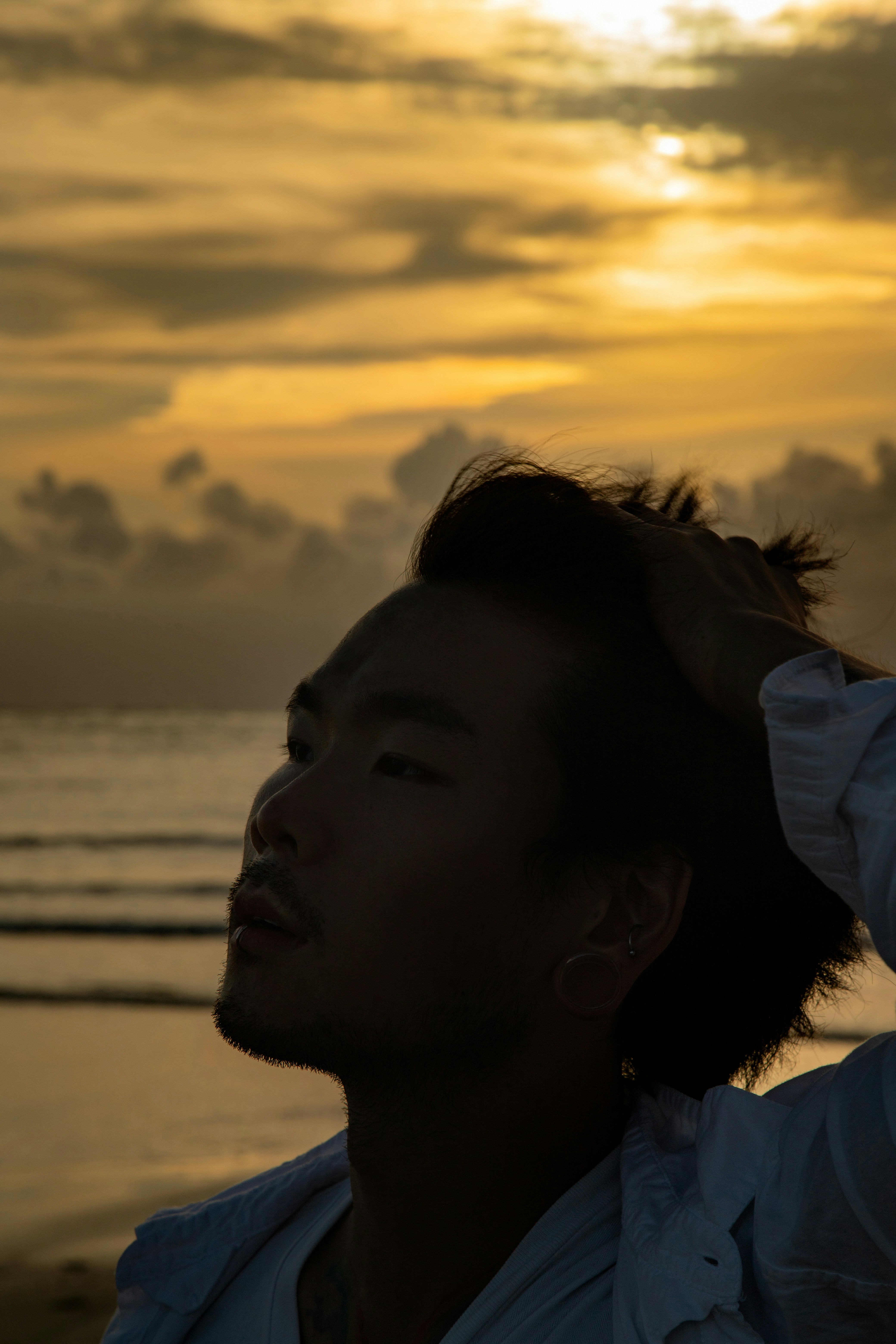 Gilded Horizon, Quiet Silhouette: a Beach Portrait at Sunset