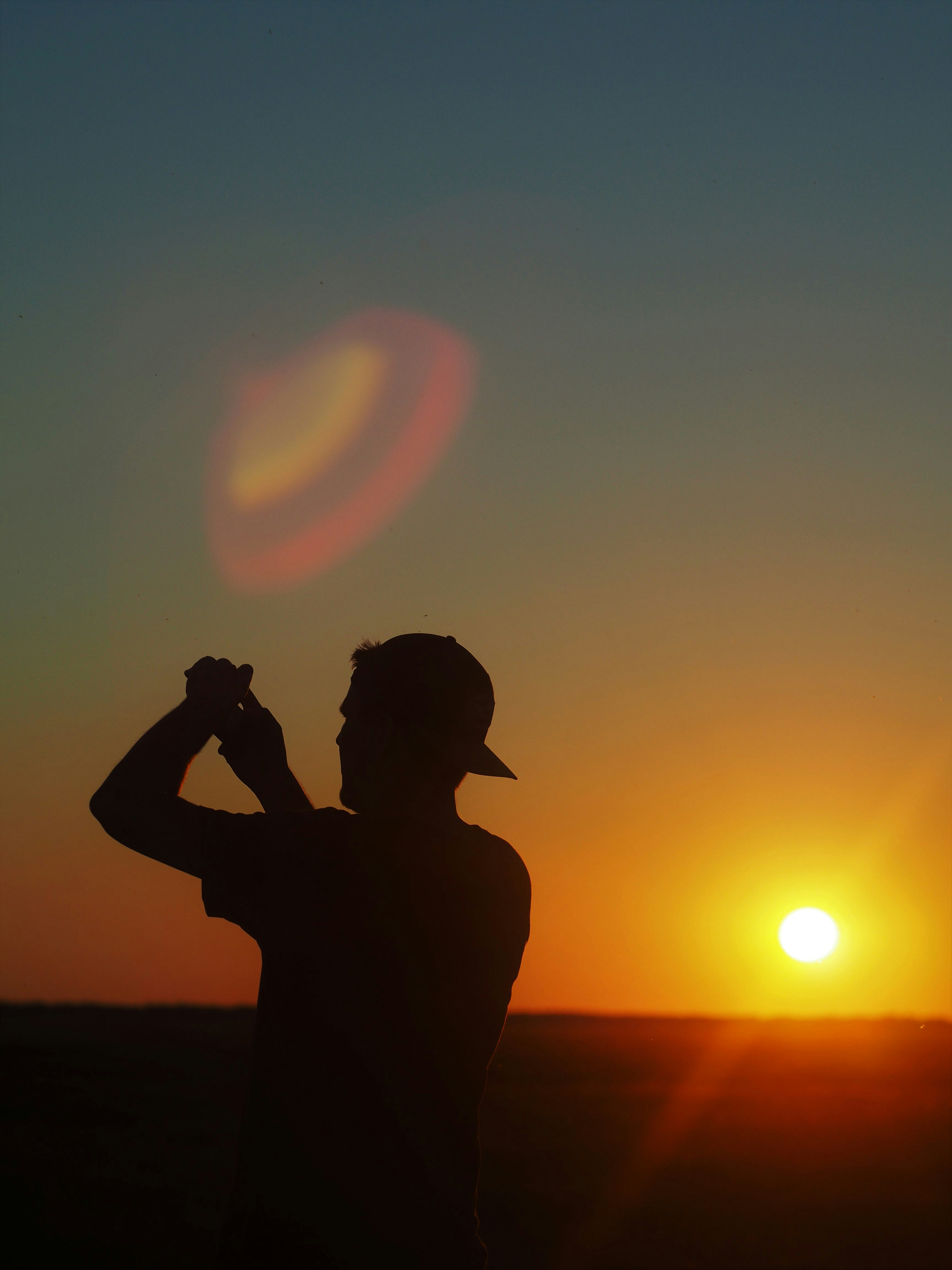 Silhouette at Sunset: The Photographer's Quiet Moment