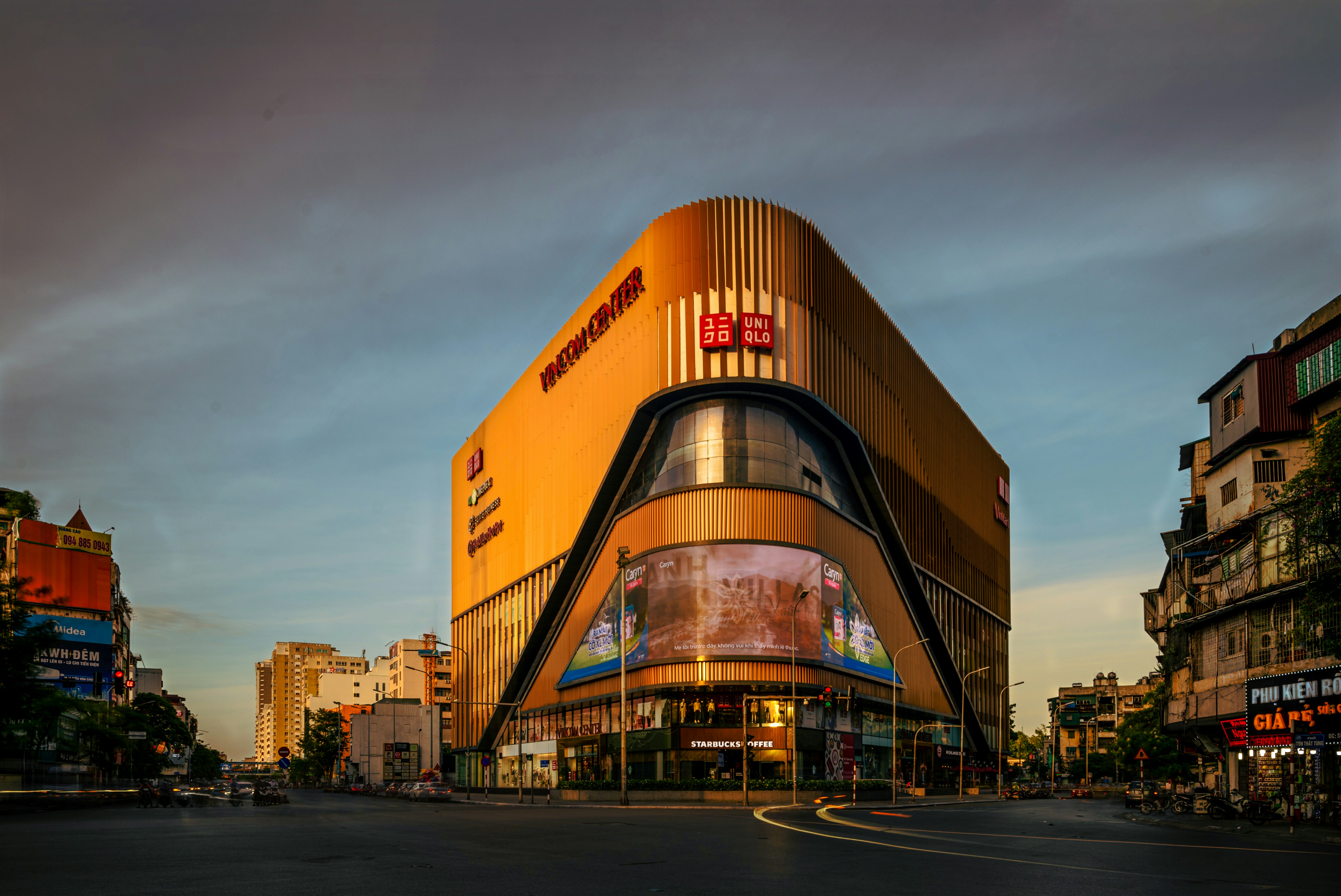 The Gilded Curve at Dusk: Neon-Fronted Urban Beacon