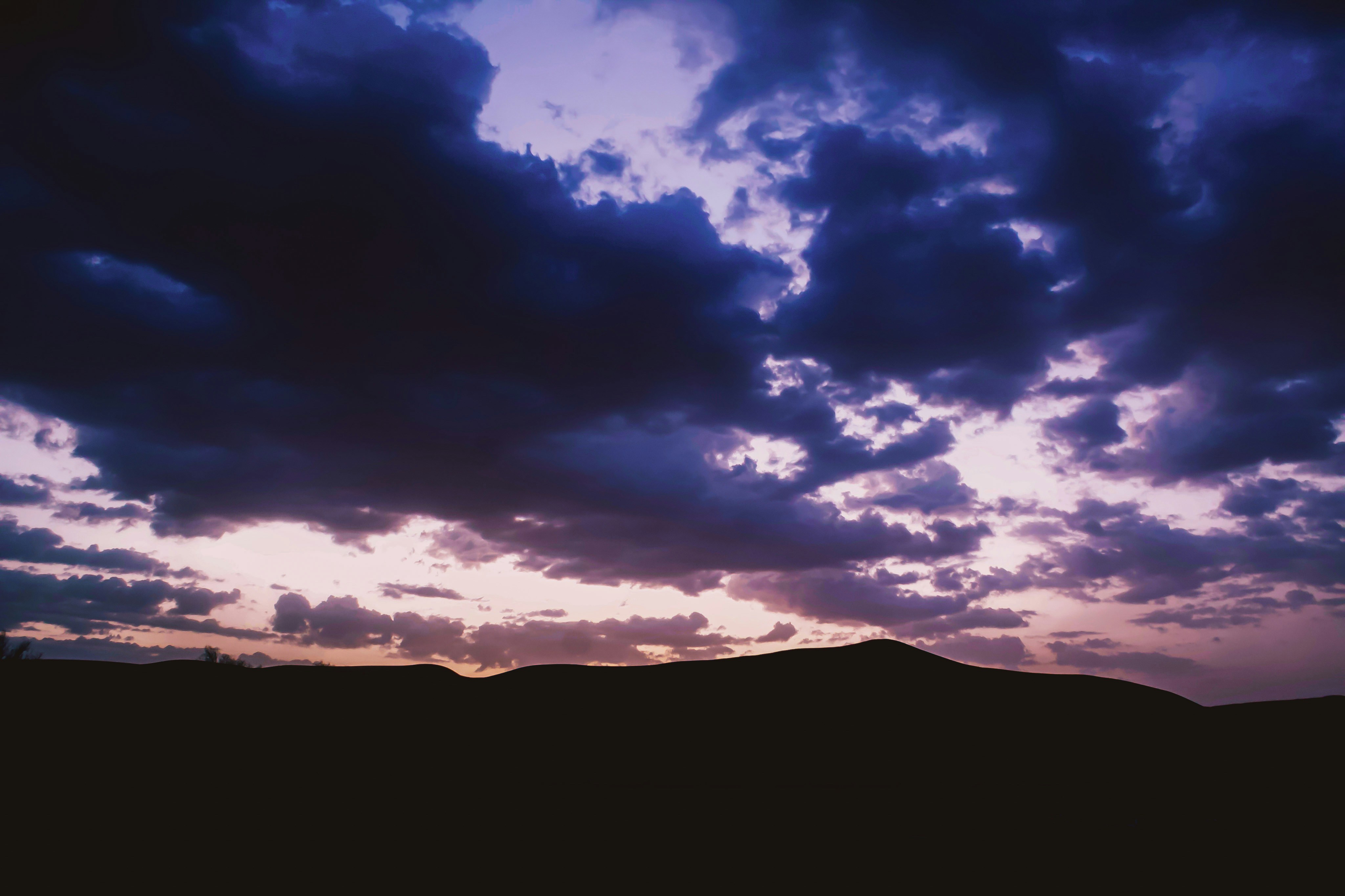 Silhouette of mountain under cloudy sky during sunset photo – Free ...