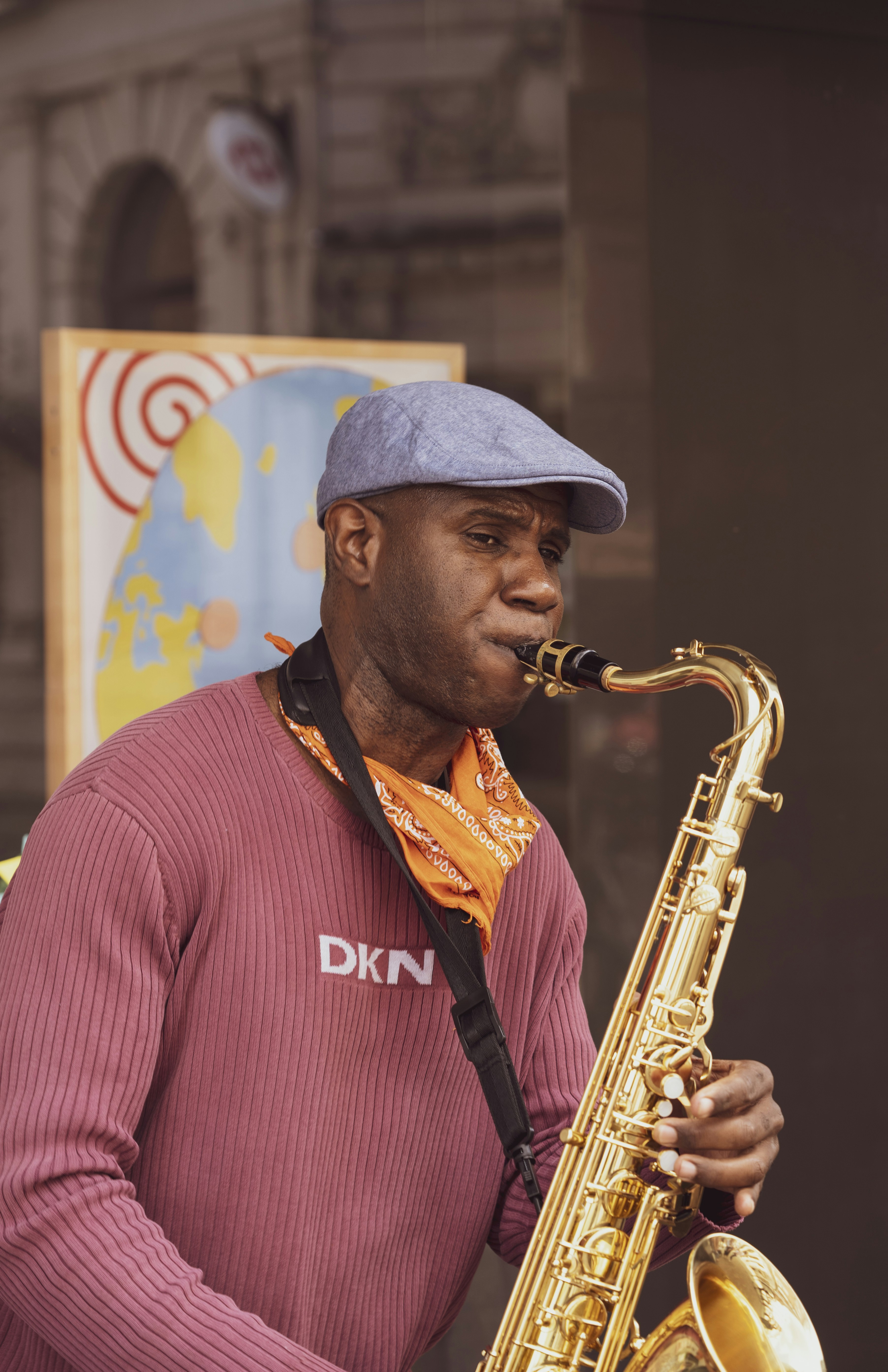 Man in red and white striped polo shirt playing saxophone photo – Free ...