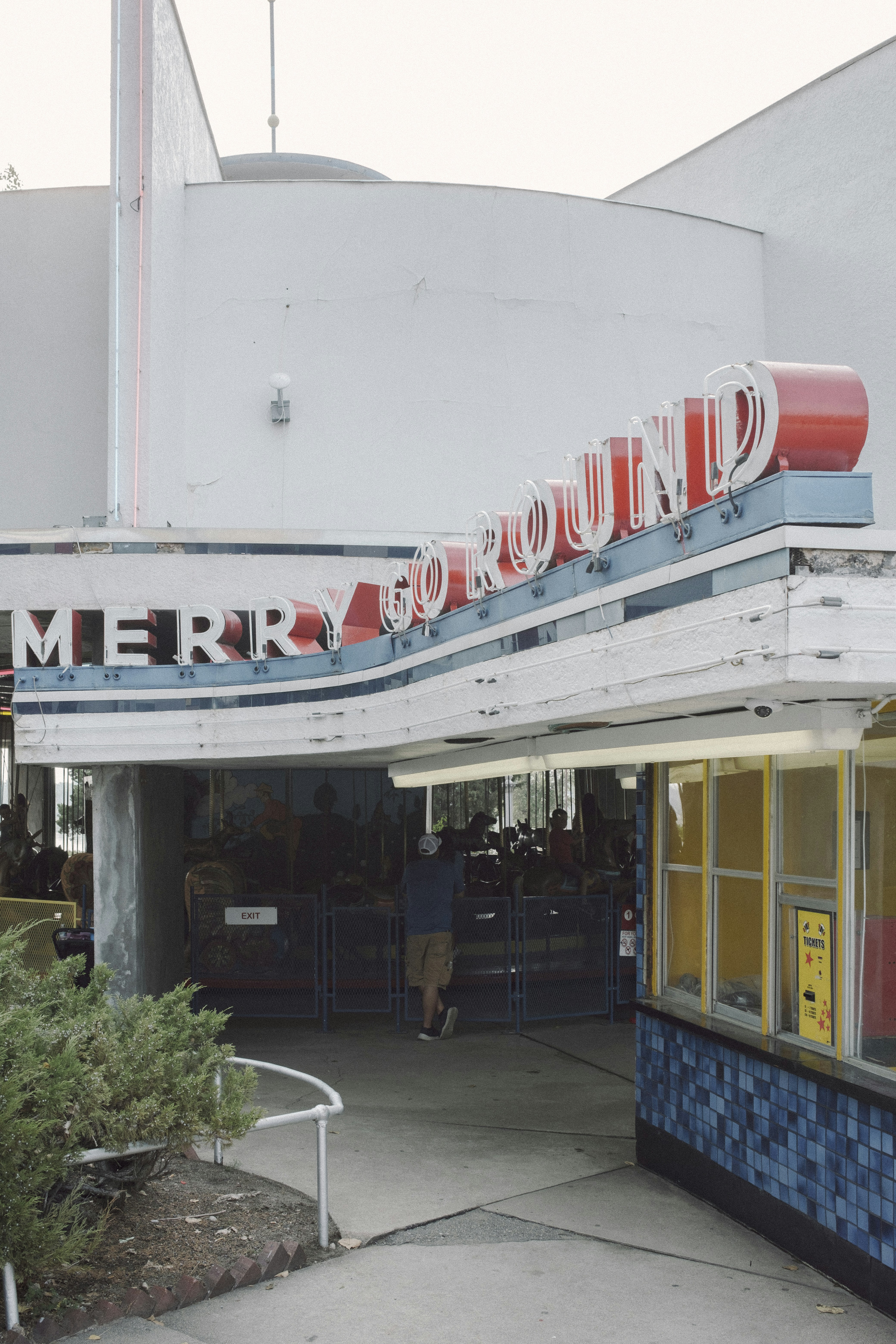 Merry-Go-Round Marquee Curves Over a Sunlit Entrance