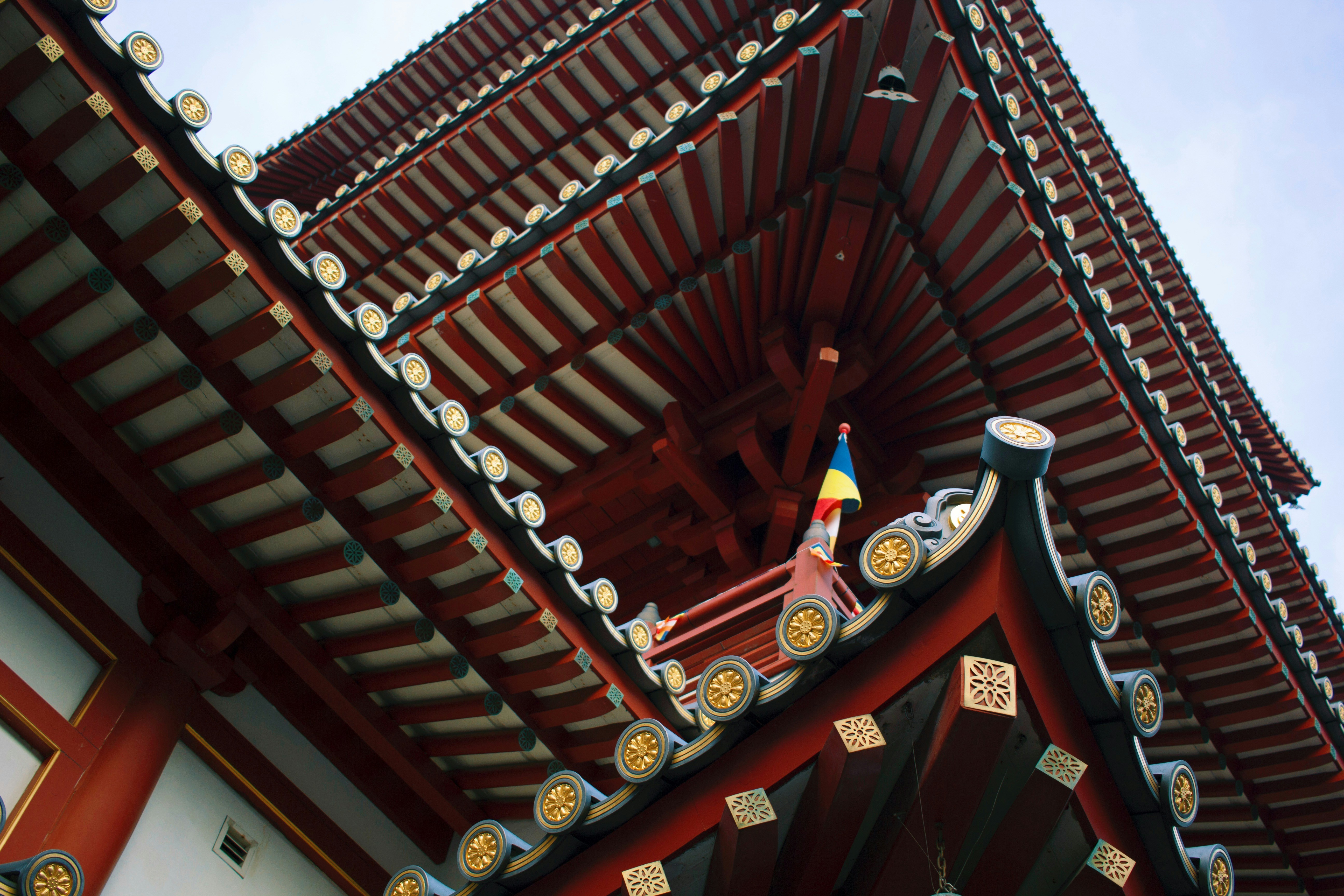Red Timber Reverence: A Close-Up of Ancient Roof Ornaments