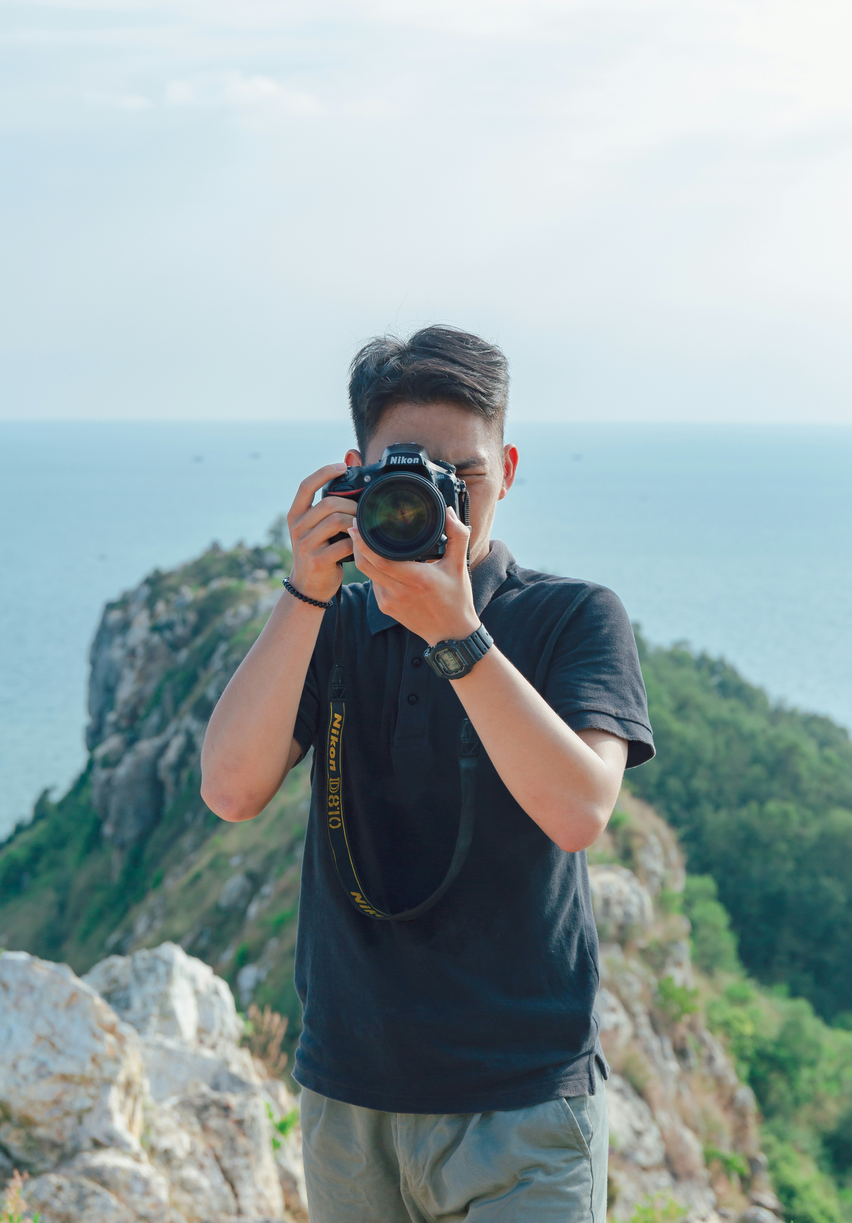 Man in black crew neck t-shirt holding black dslr camera photo – Free ...