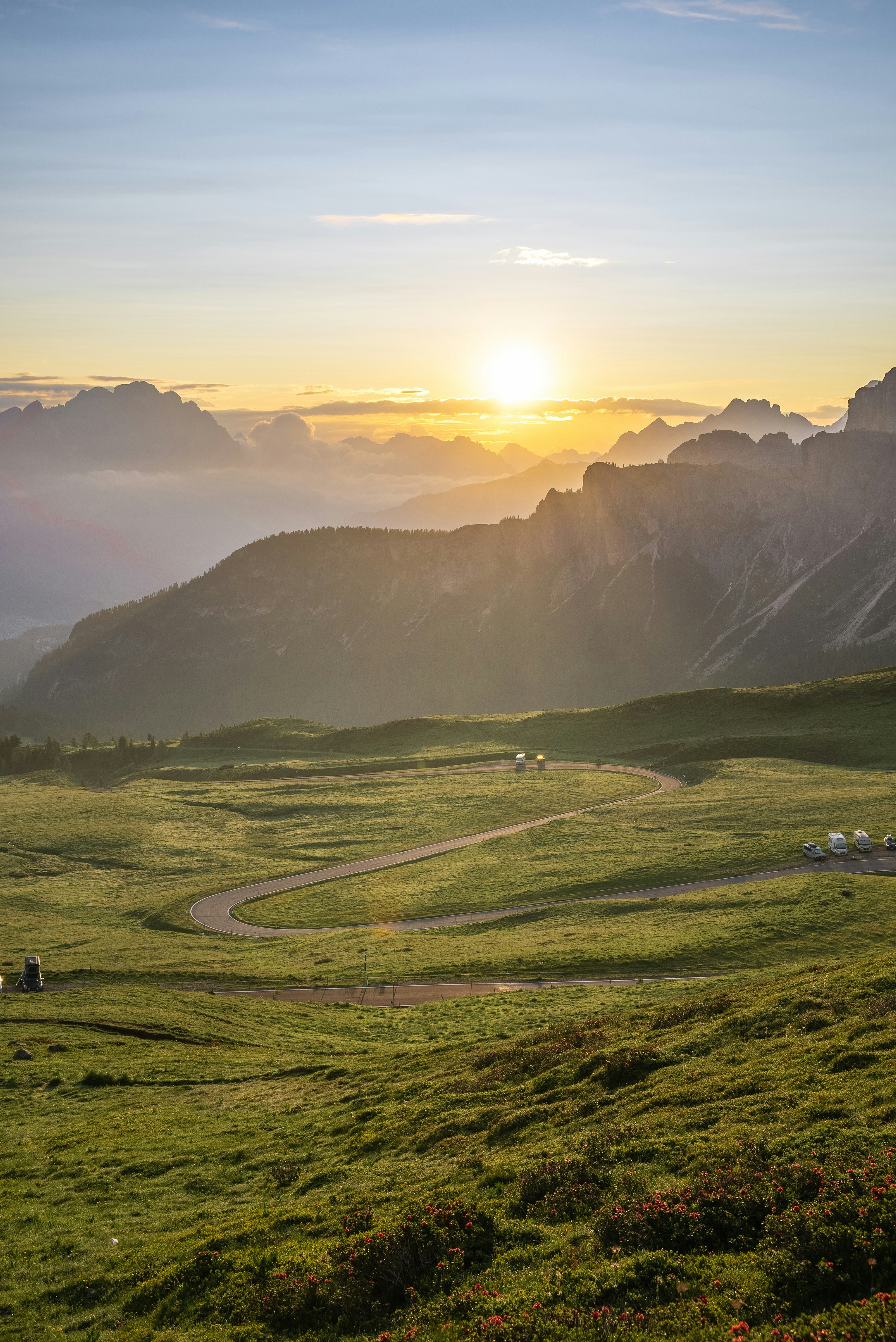 Sunrise over a Curving Mountain Road