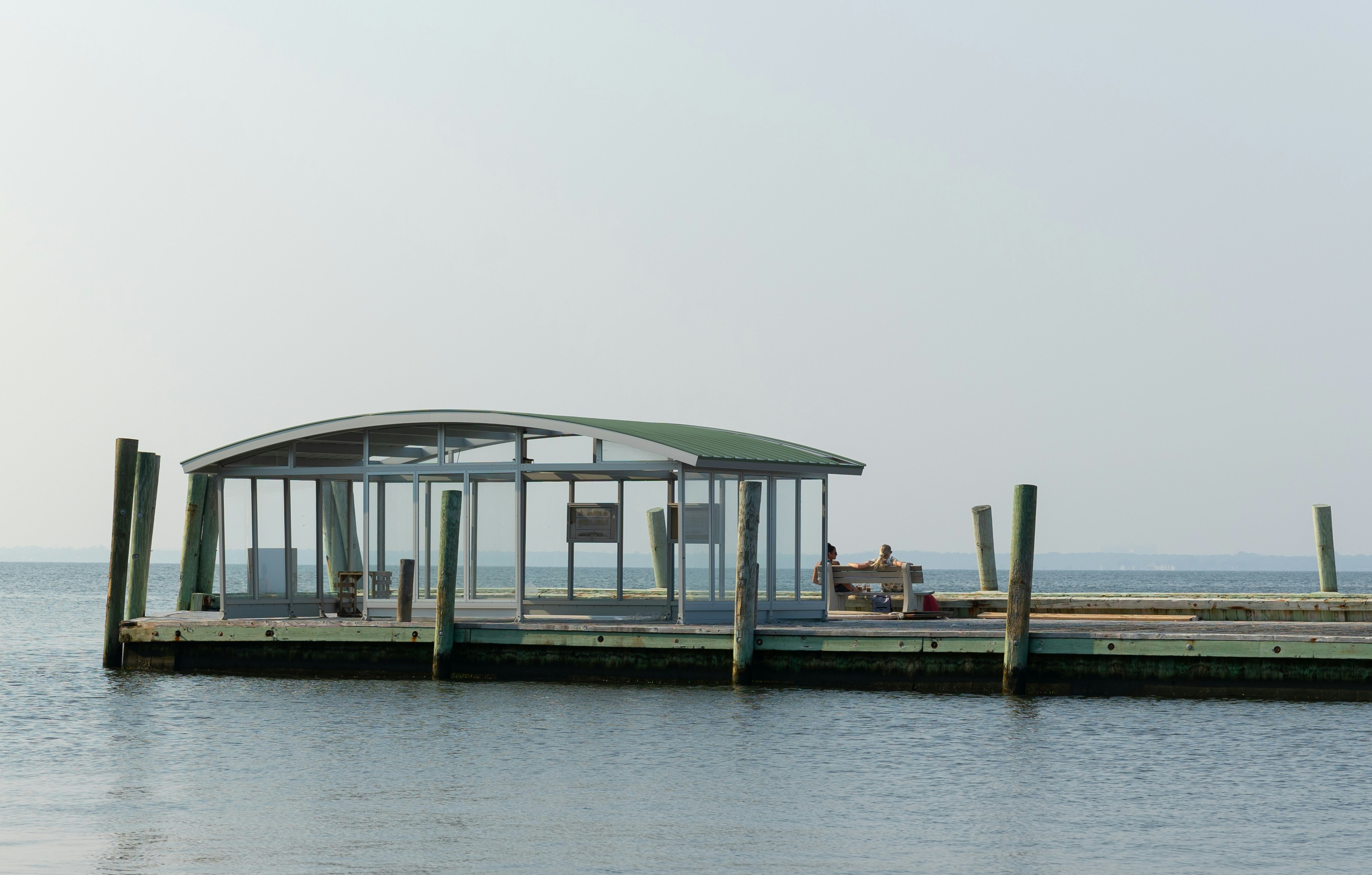 Harbor Pavilion on Glassy Water: A Quiet Pier Reaching into Mist