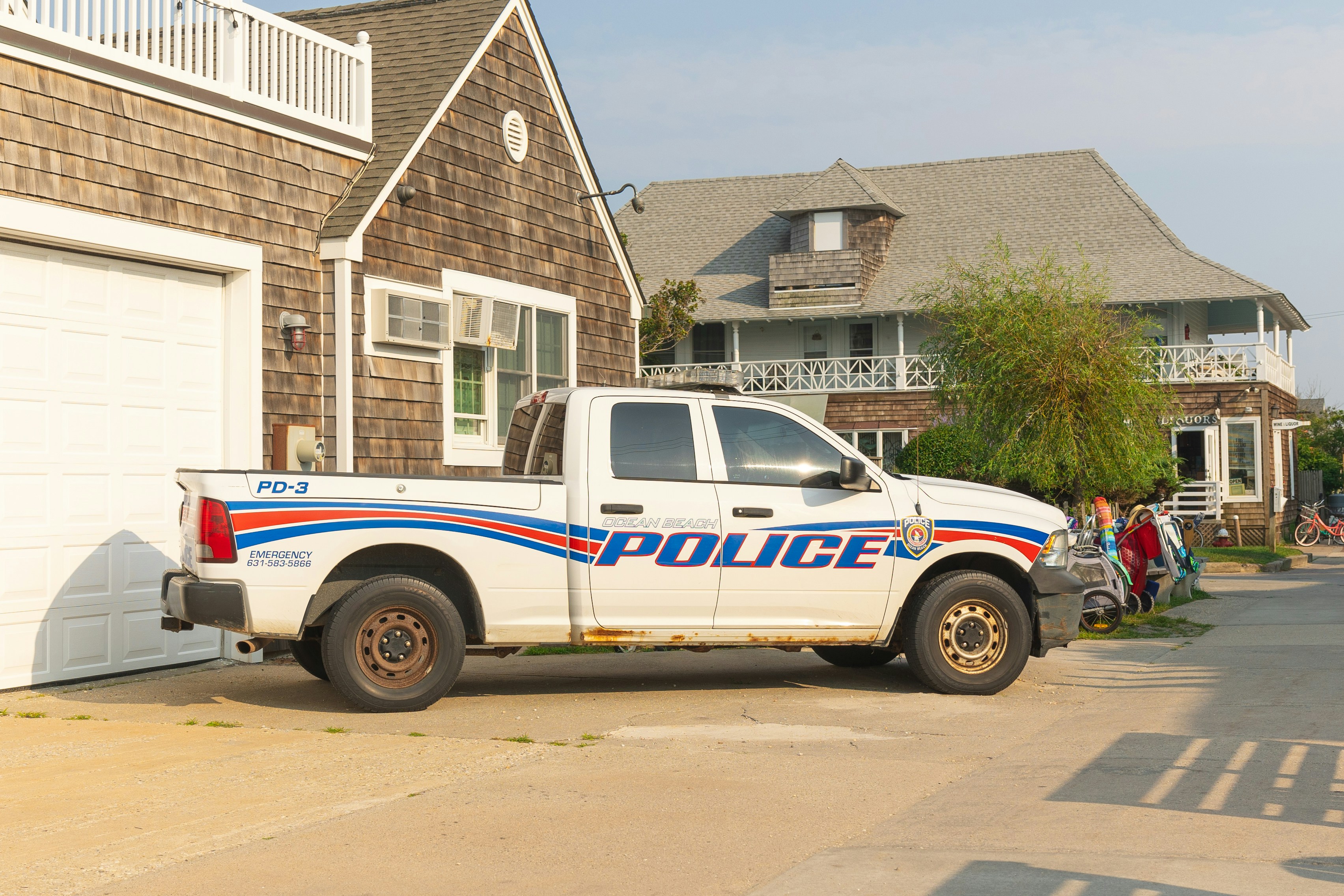 a police truck parked in front of a house