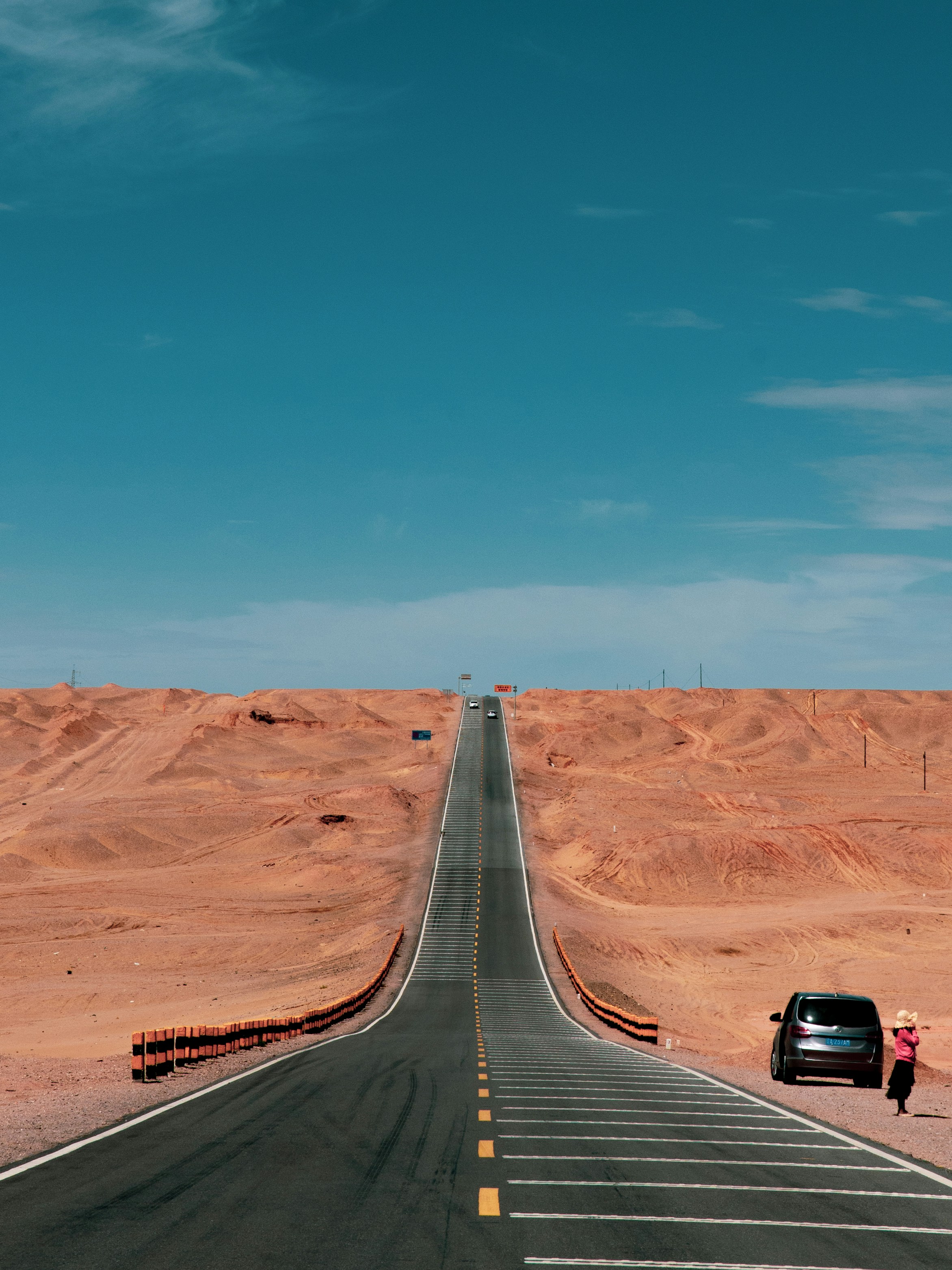 Desert Highway Ascends: A Distant Horizon Rising Over a Painted Dune
