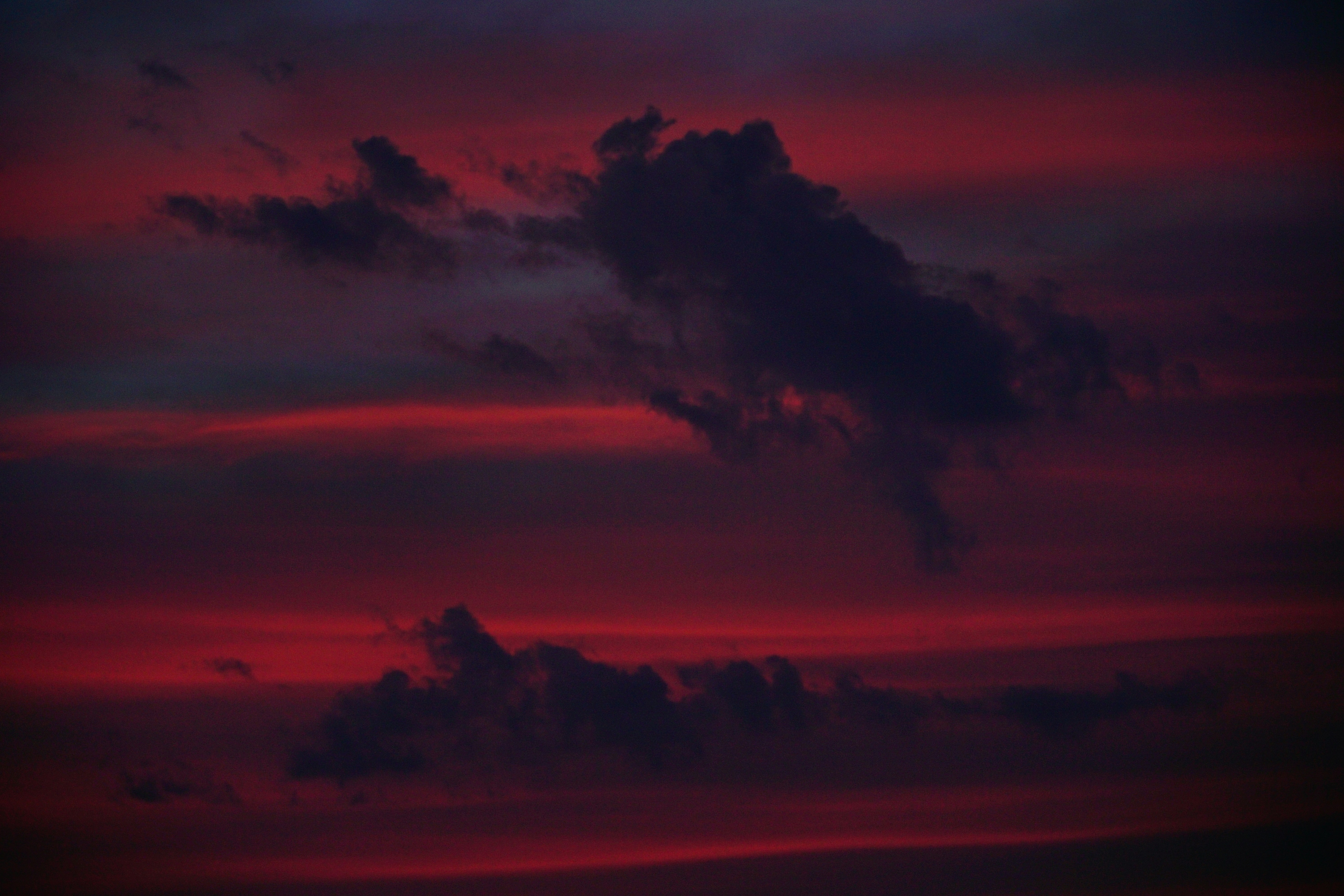 Crimson Strata: Dusk Clouds Carved by Quiet Fire