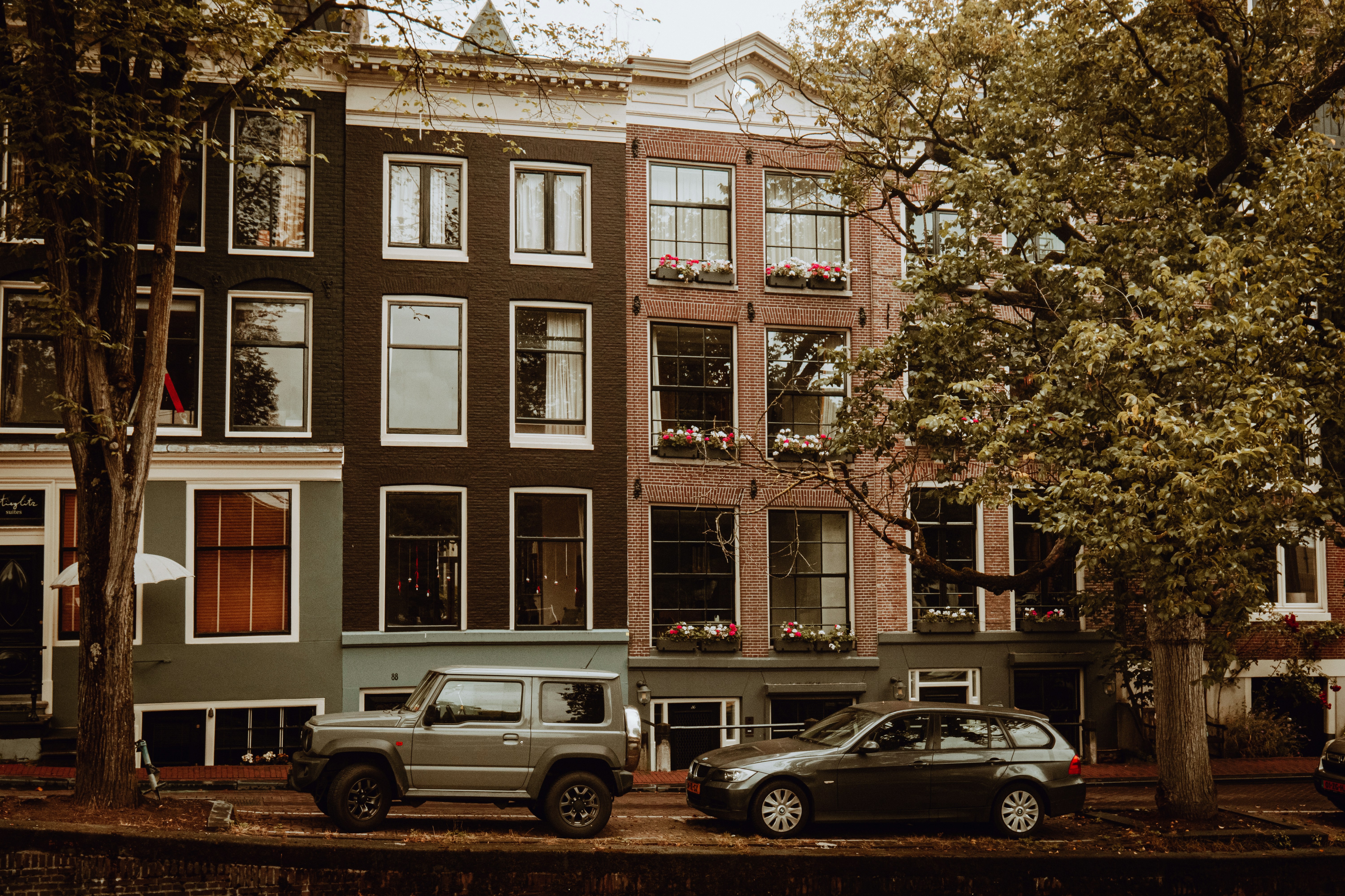 Amber Hour on a Brick Row: Quiet Cars and Window Boxes