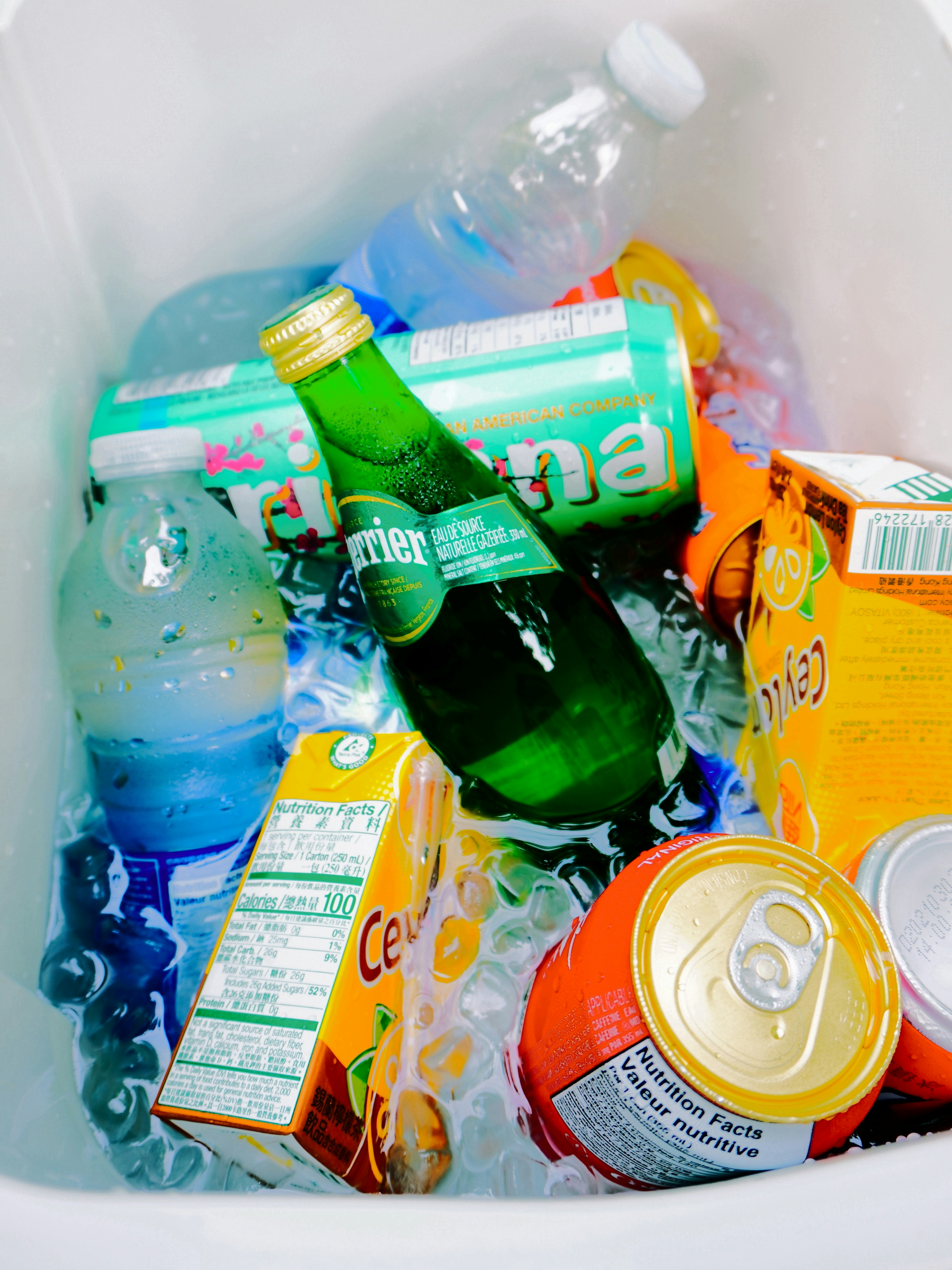 Sprite plastic bottle beside orange soda can photo – Free Montréal ...