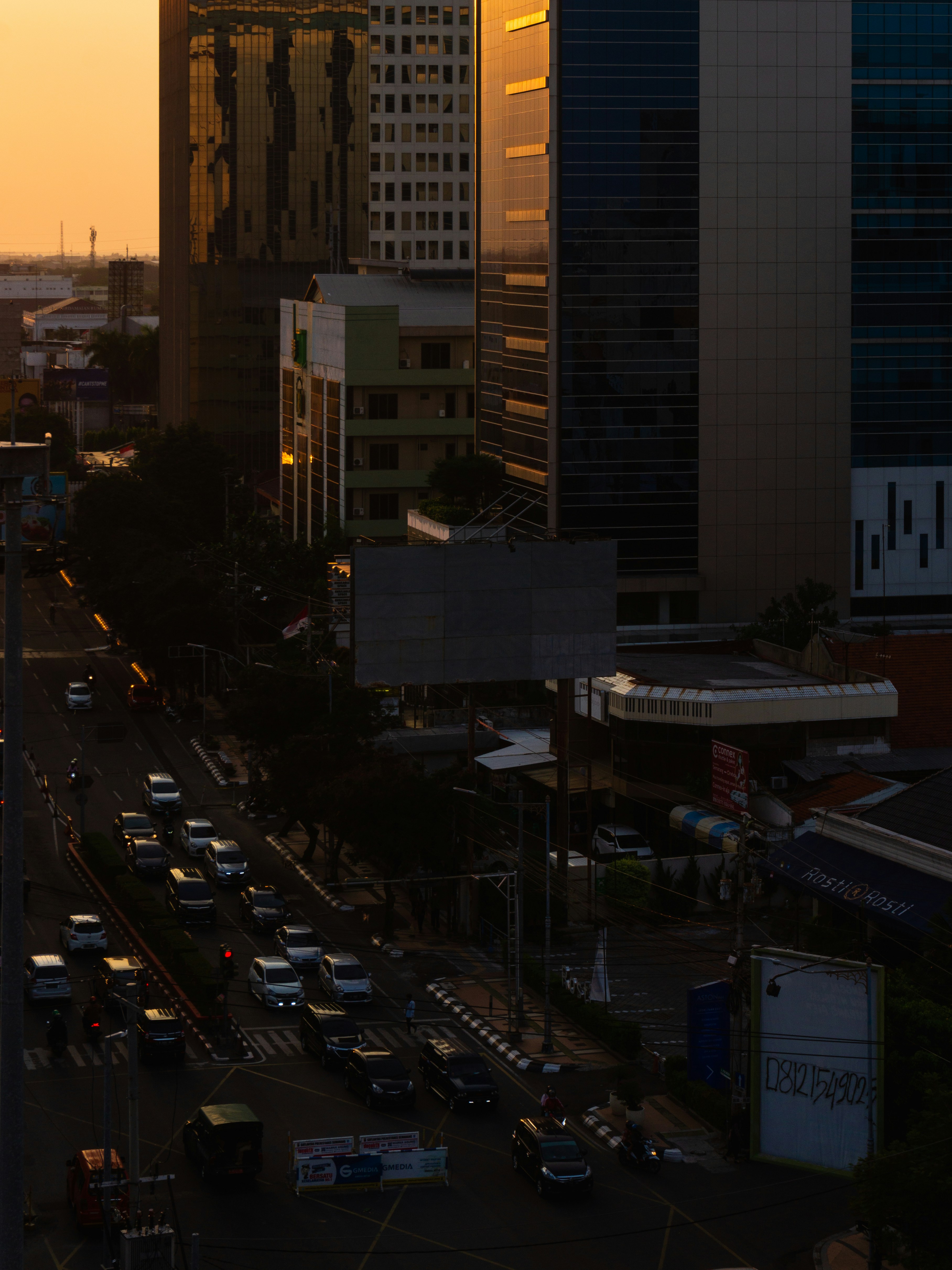 Golden Hour Between Glass Towers: Sunset Pulse on a Dense City Corridor
