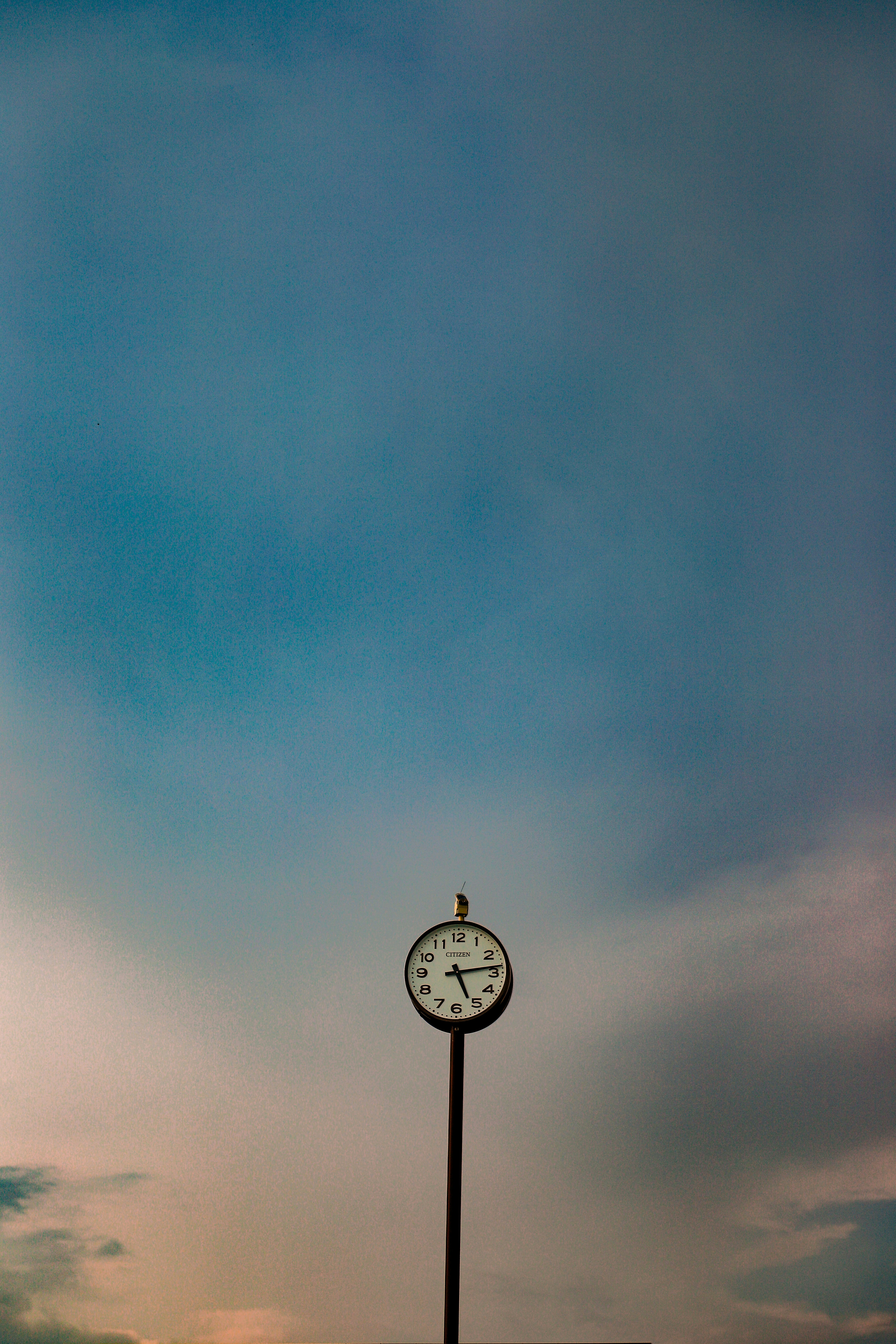 Timekeeper on a Post Beneath an Expansive Sky