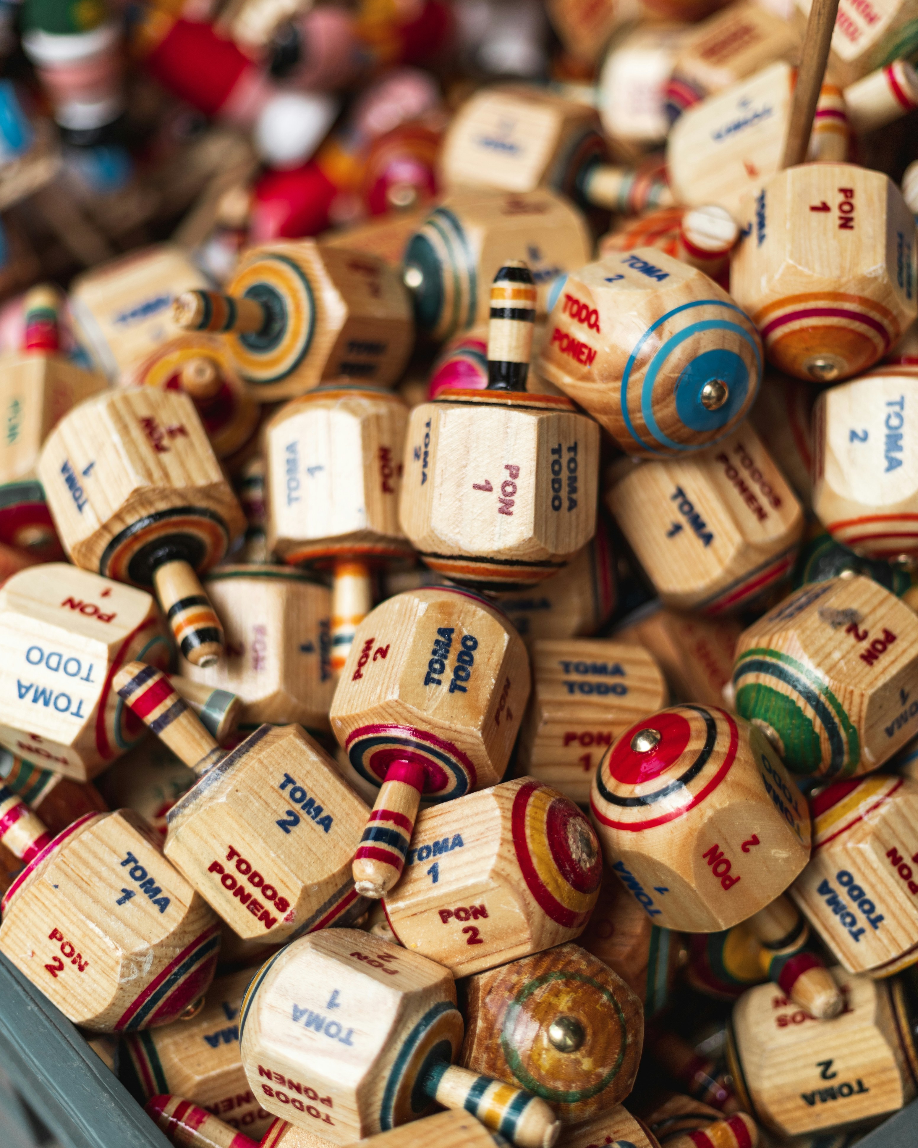 Vibrant Chaos of Wooden Spinning Tops
