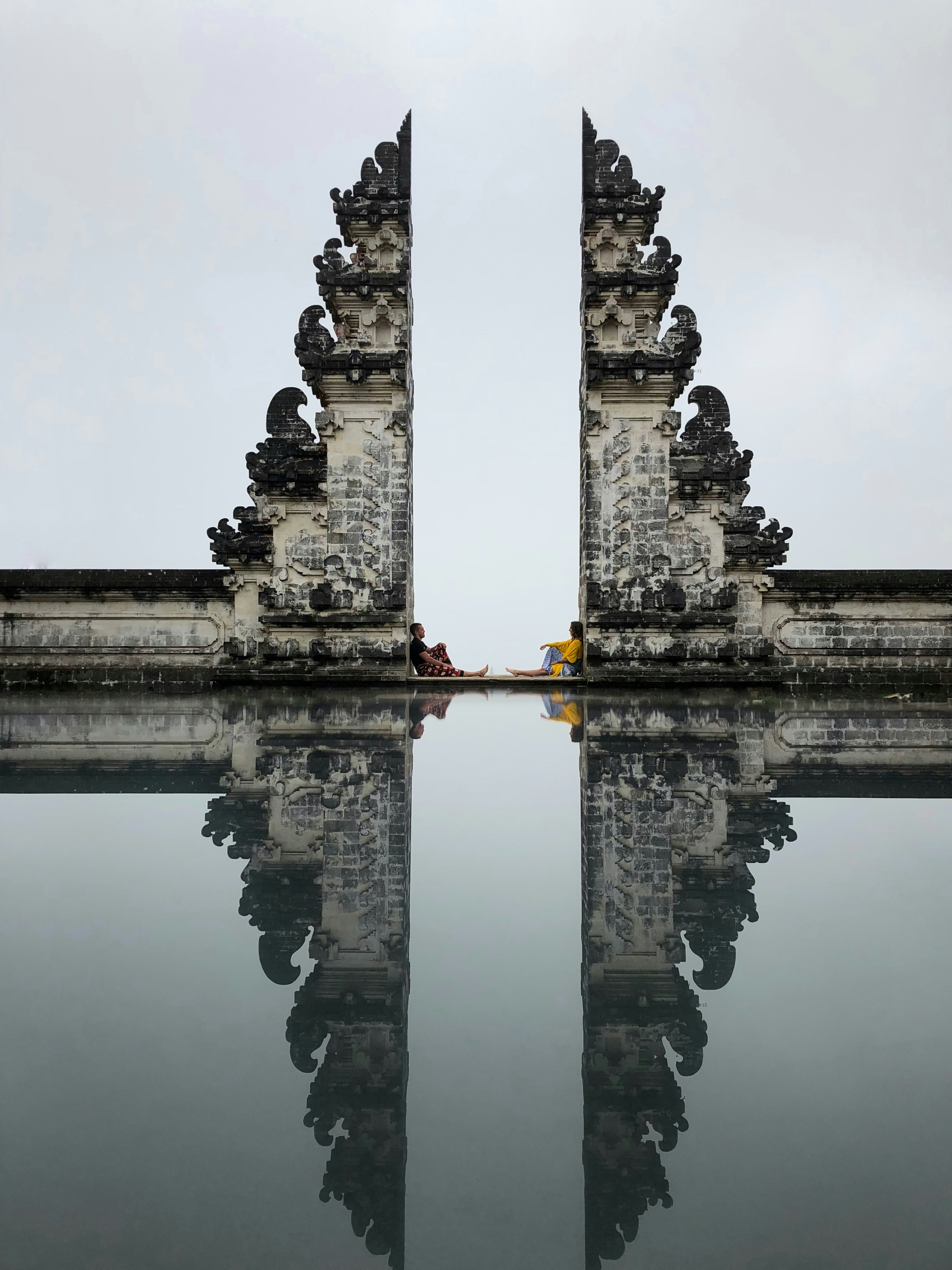 Gray concrete pillars on water photo – Free Temple Image on Unsplash