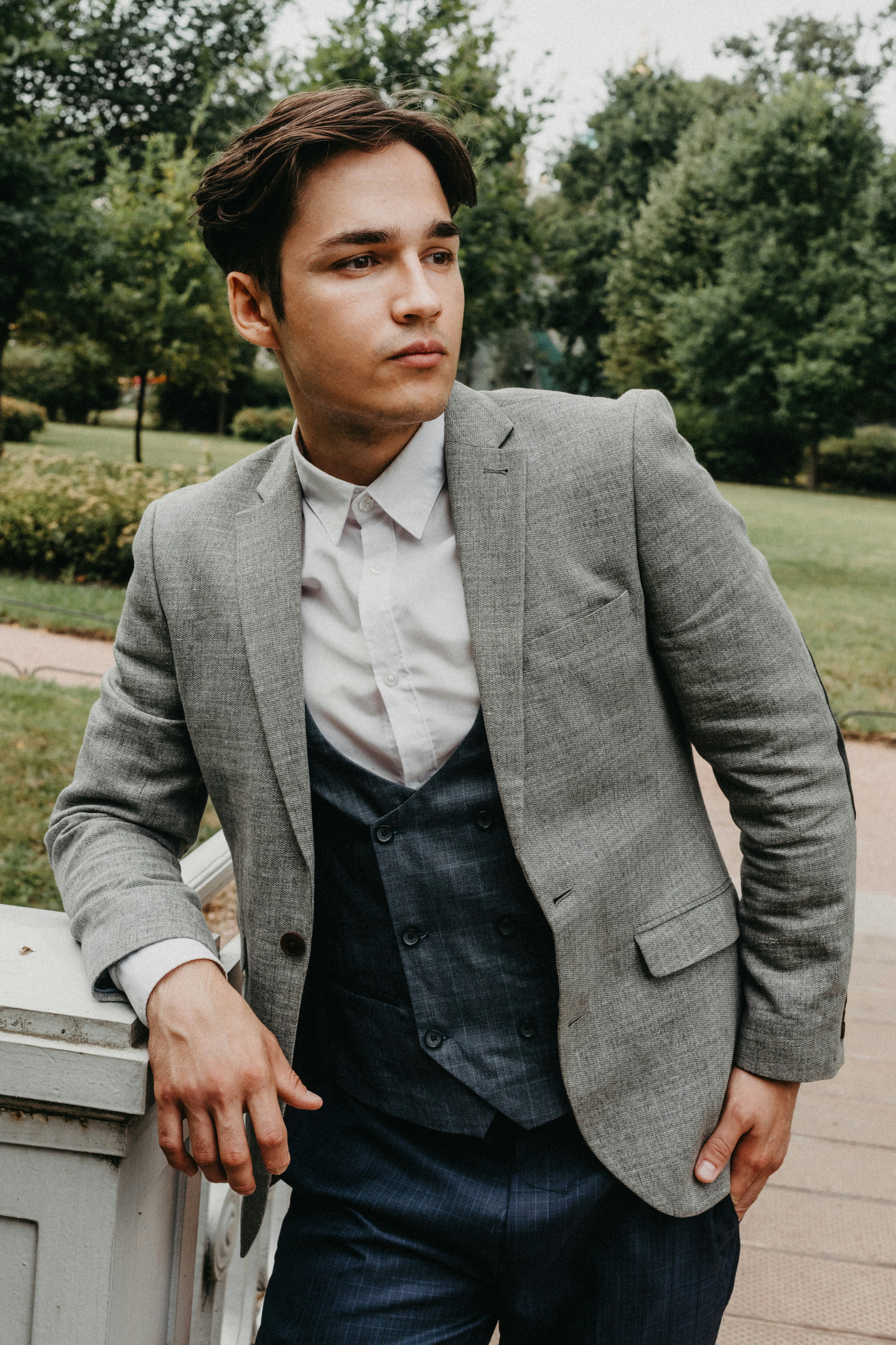 Slim-gray Suit, Green Parks, and a Contemplative Gaze