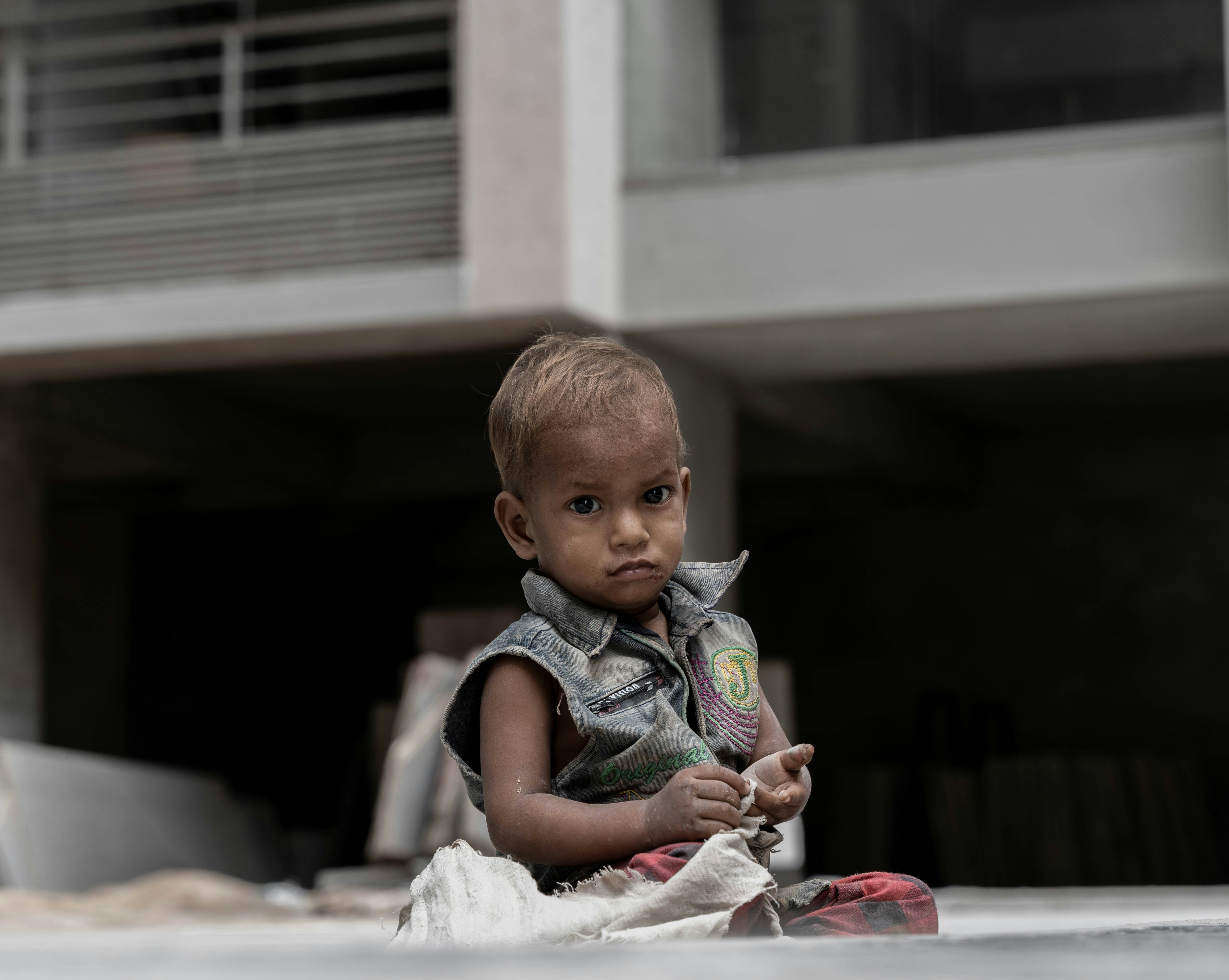 Dust and Denim: a child anchored in a construction site frame