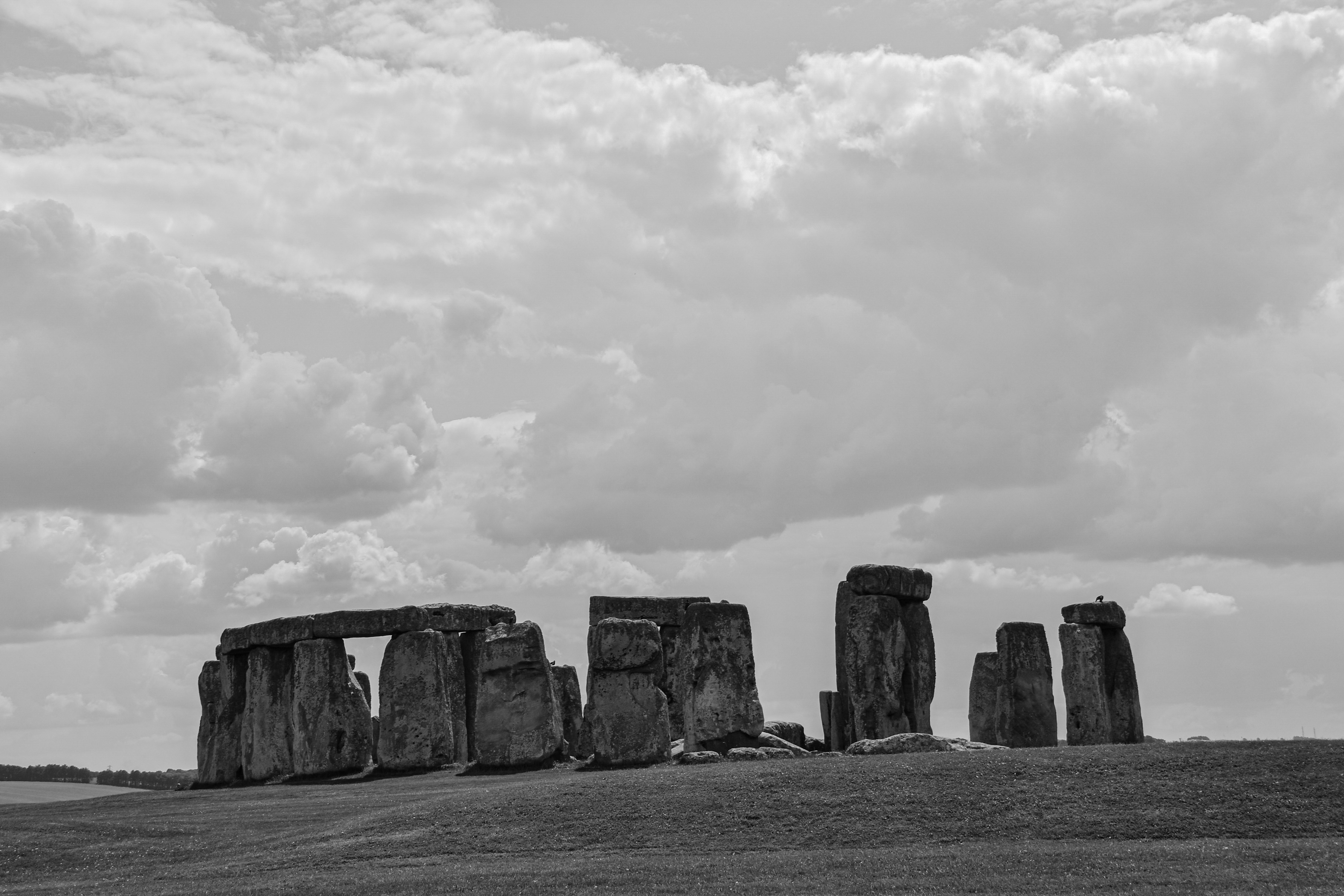 Stonehenge-like Monoliths Stand Quietly Against a Looming Sky