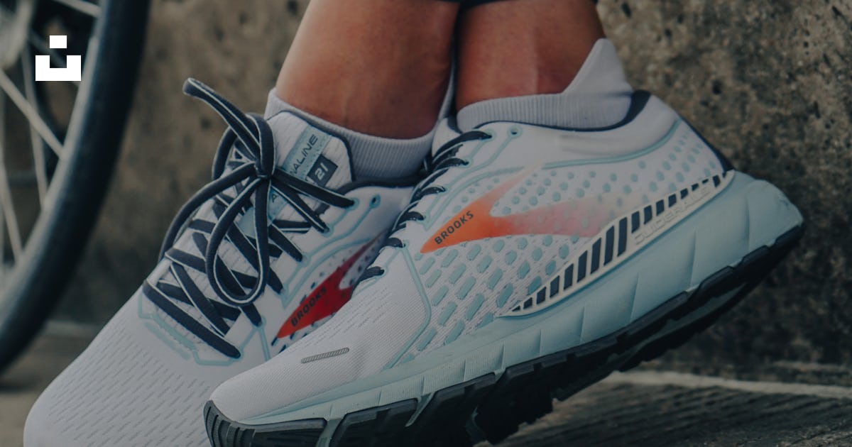 Person Wearing Gray And Red Nike Athletic Shoes Photo Free Run Image